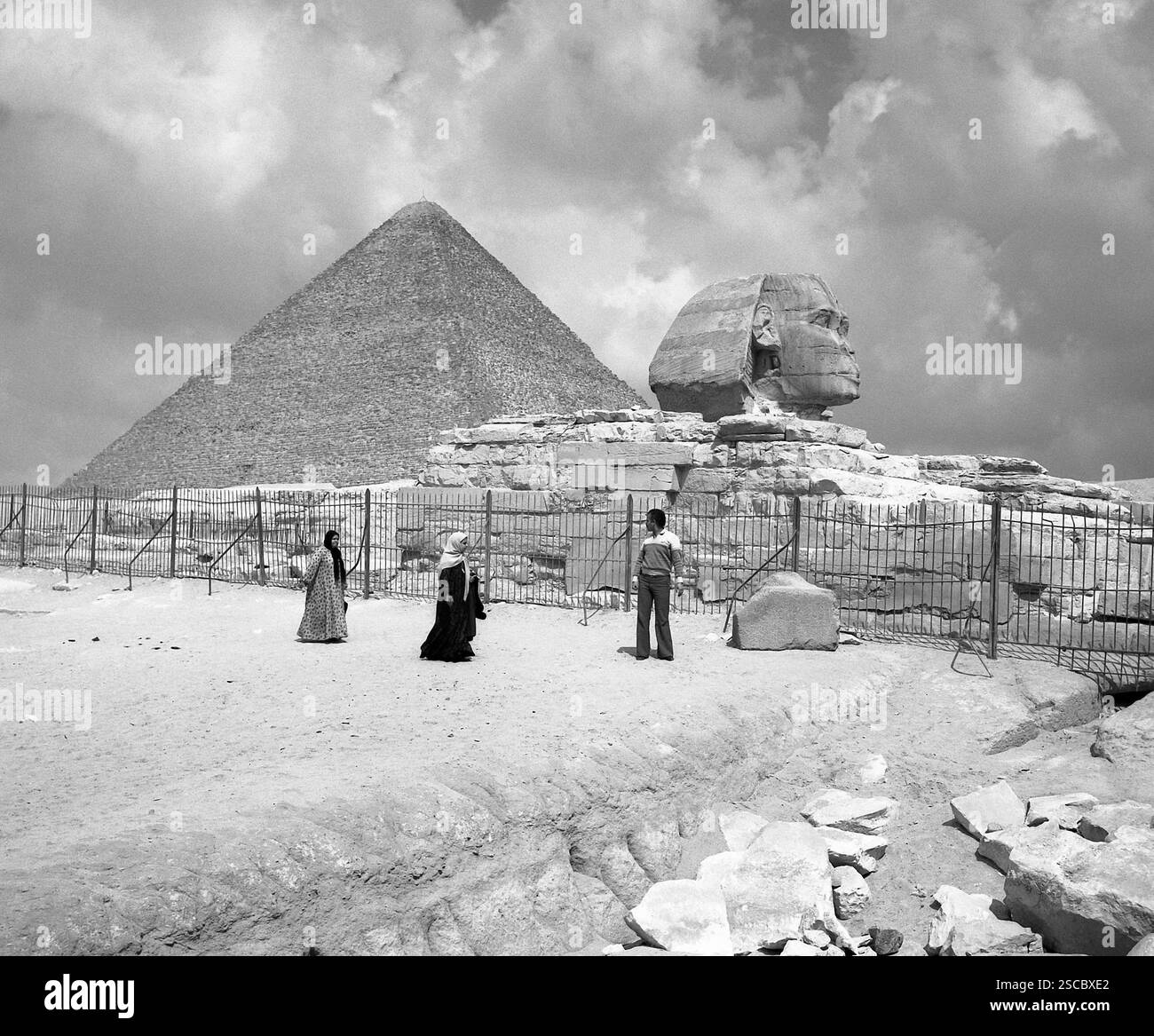 The Great Sphinx of Giza and Pyramid of Giza and in front Egyptians ...