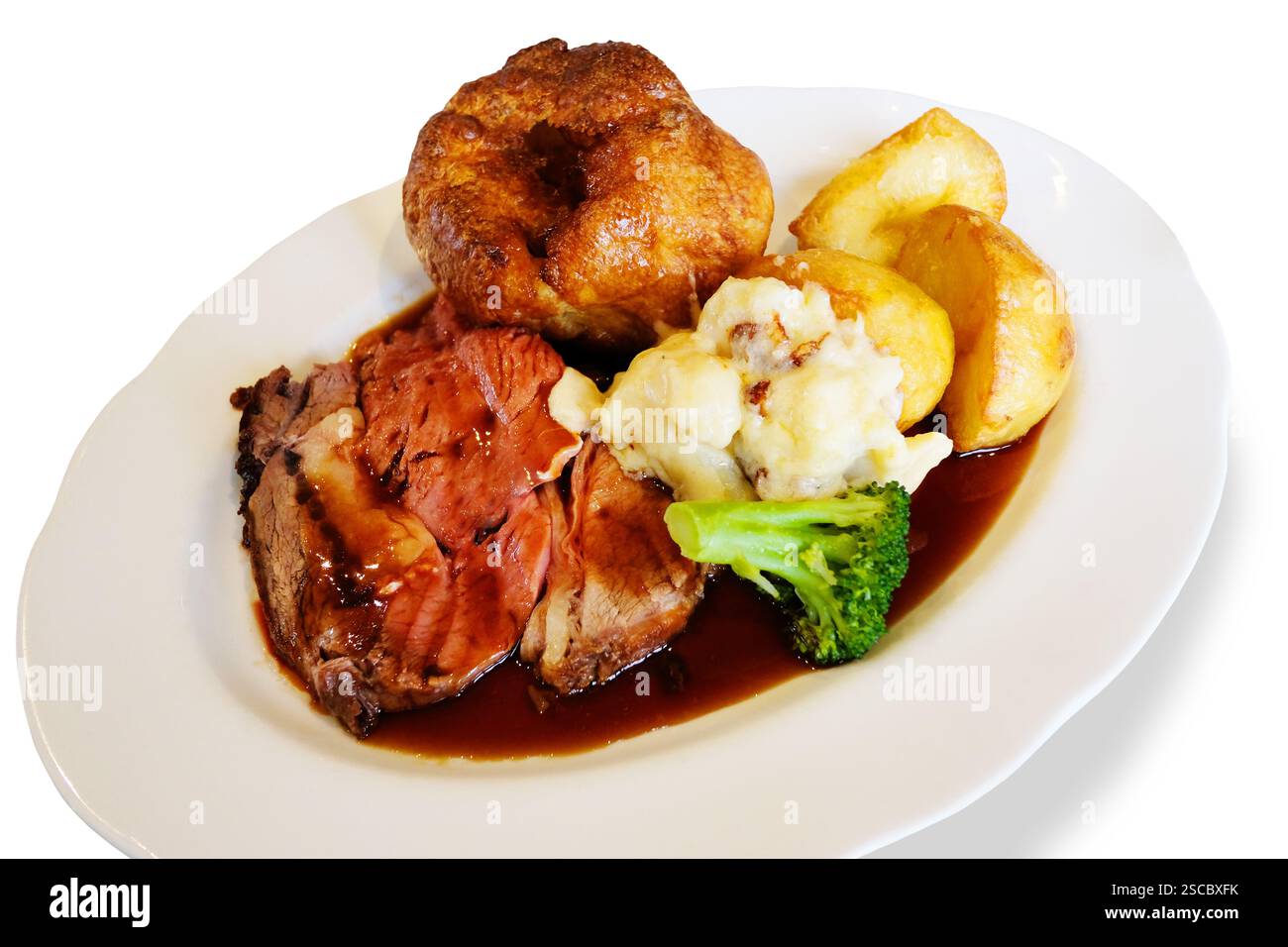 Sliced roast beef, yorkshire pudding and assorted vegetables cut out ...