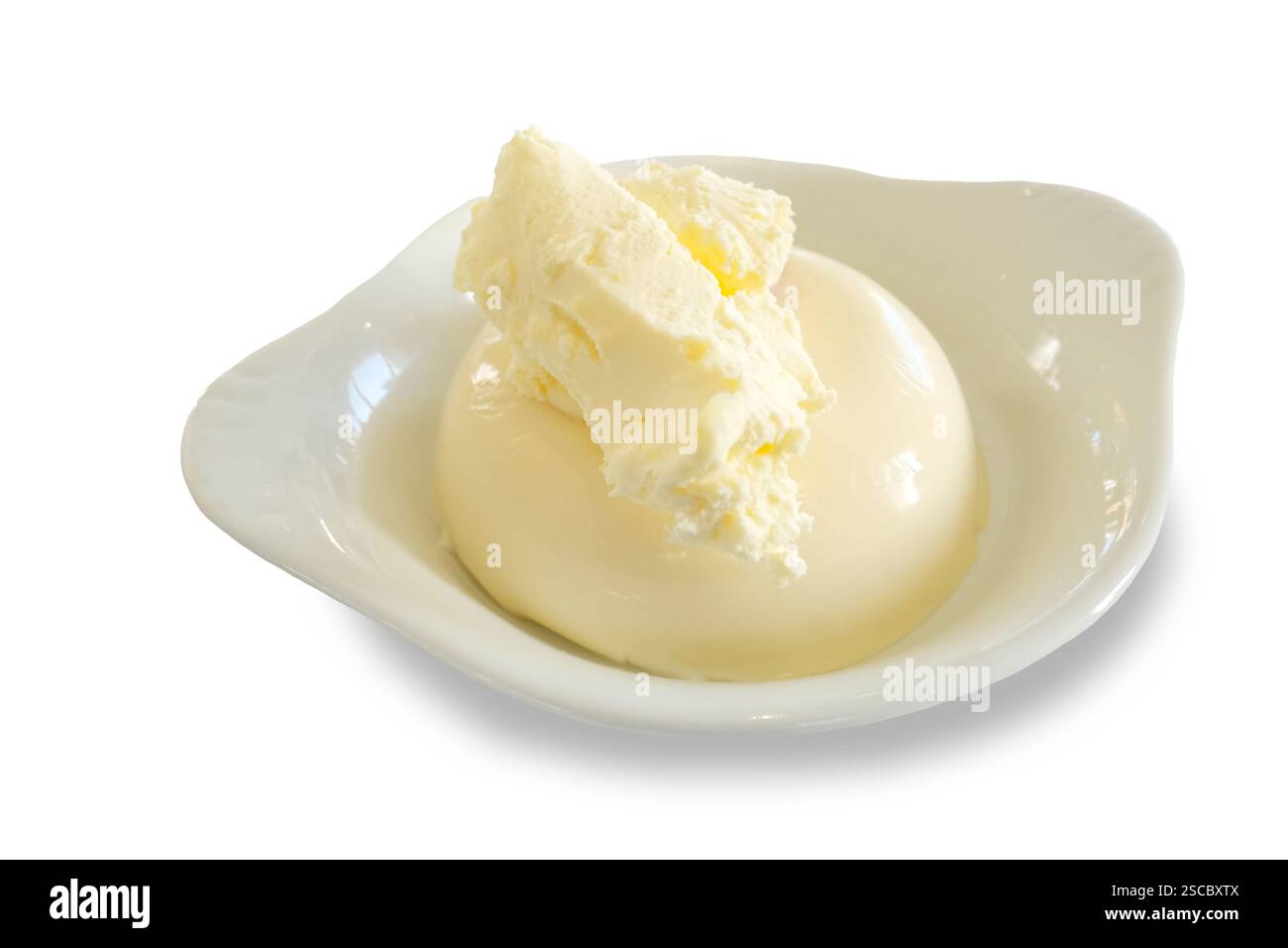 Individual serving of Panna Cotta topped with clotted cream cut out ...