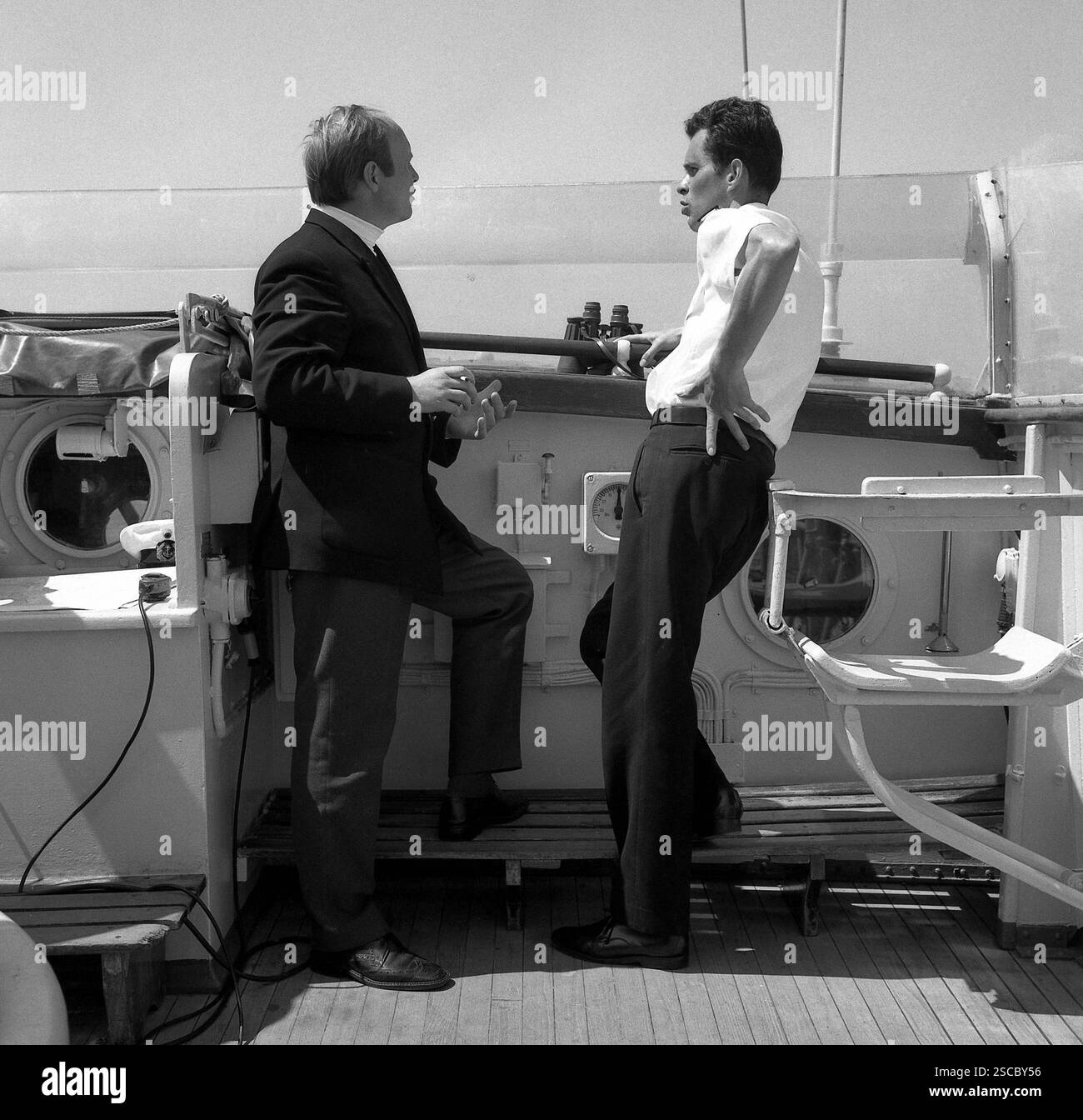 Two man in boat Black and White Stock Photos & Images - Alamy