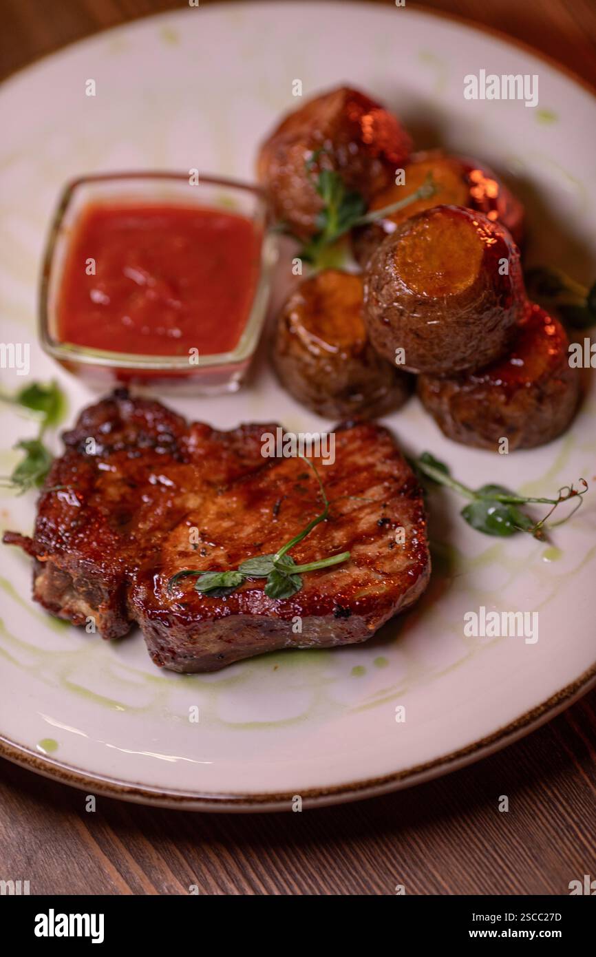 Beautiful restaurant dish golden potatoes and juicy meat, beautiful ...