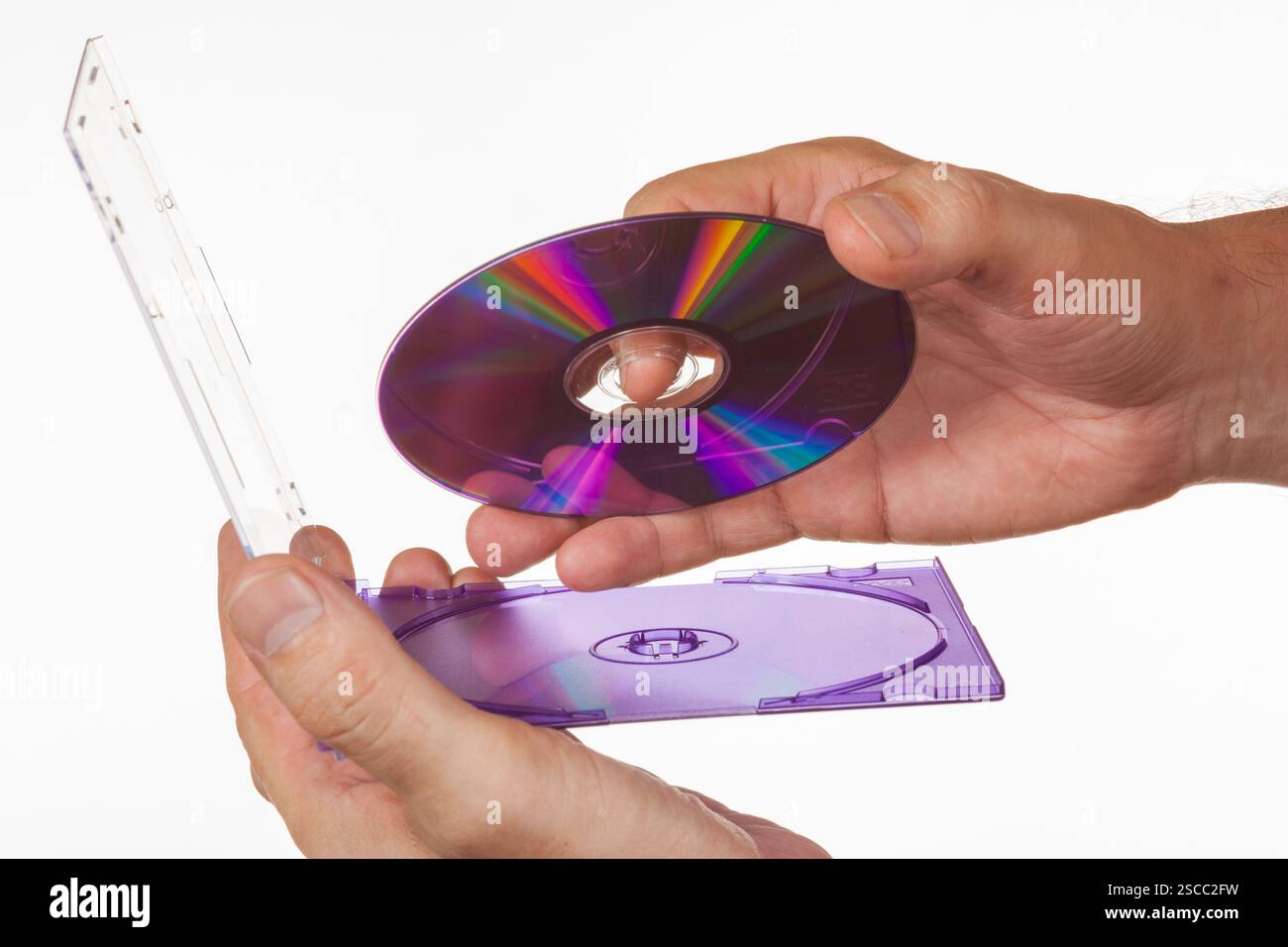 CD-ROM in hand isolated on white background Stock Photo - Alamy