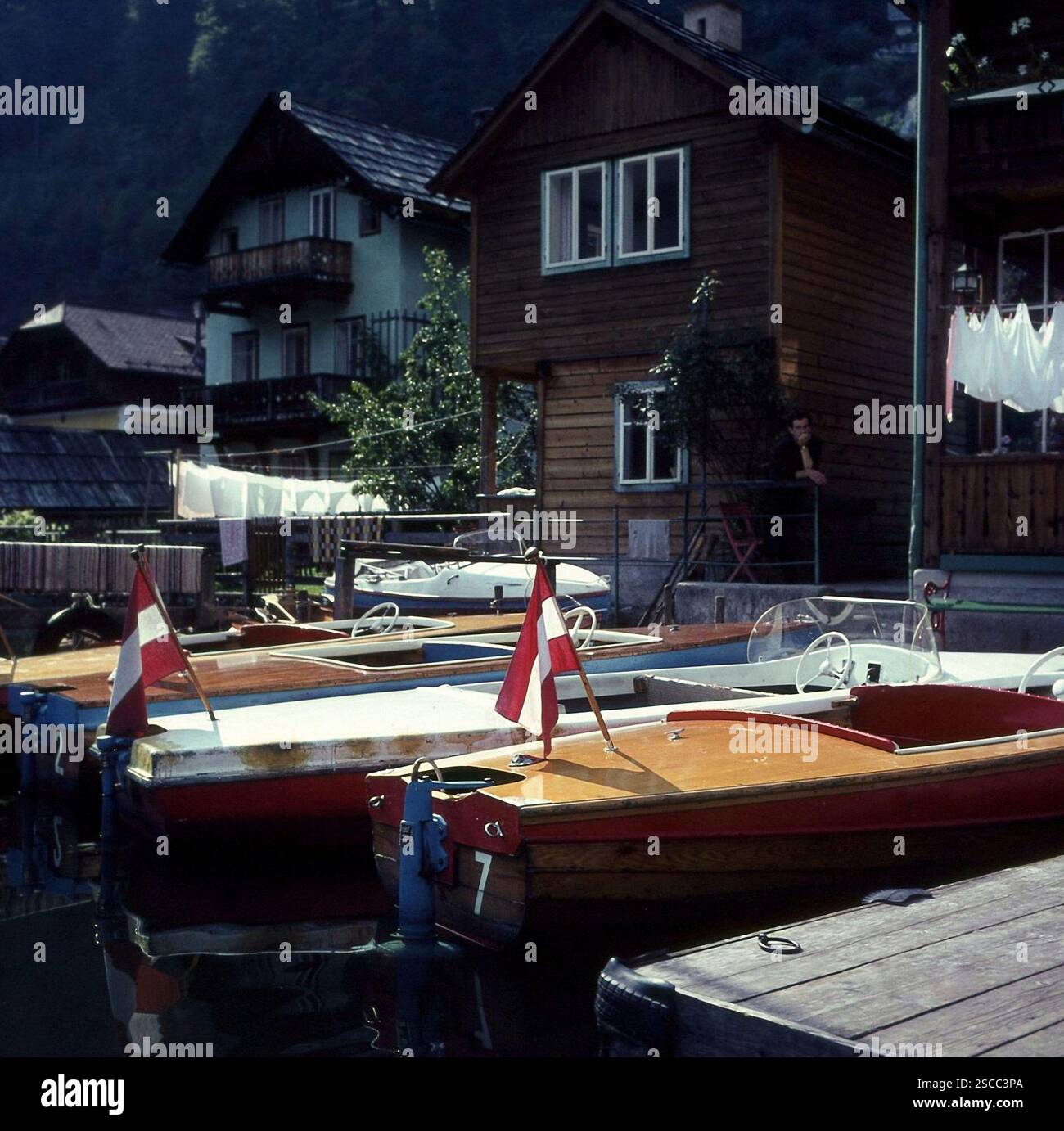 Motor boats with Austrian flag on Hallstaetter See (Lake Hallstatt) in ...