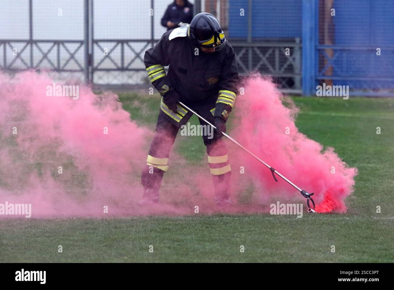 Italian Firefighter Removing a Smoke Bomb on Soccer Field During Match ...