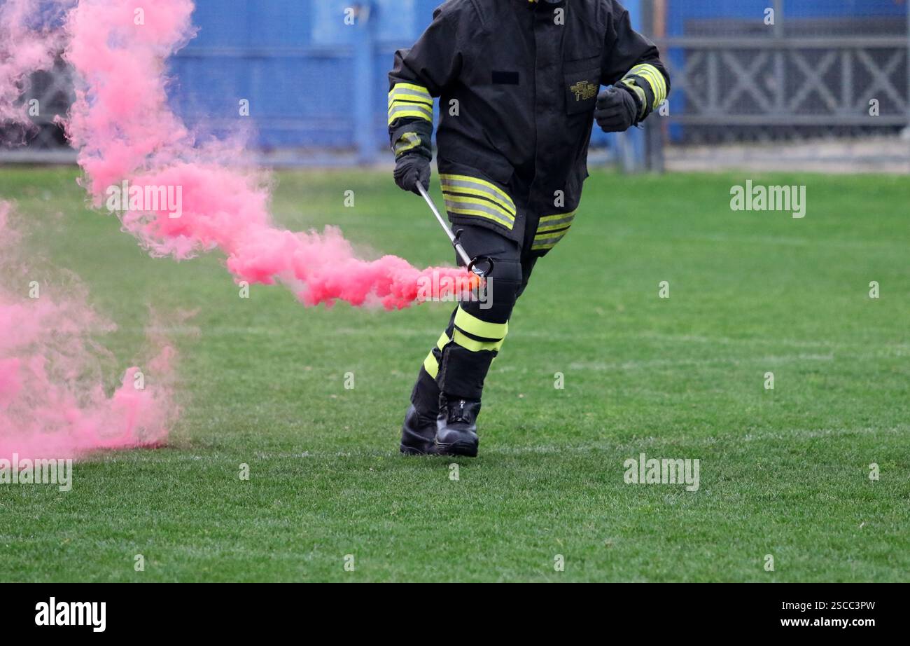 Italian Firefighter Removing a Smoke Bomb on Soccer Field During Match ...