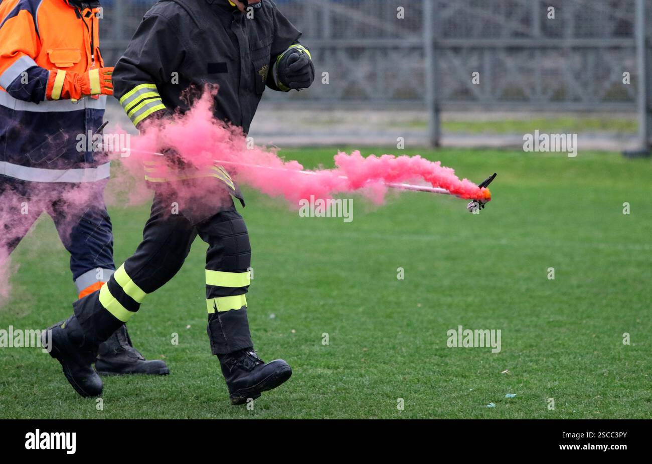 Italian Firefighter Removing a Smoke Bomb on Soccer Field During Match ...