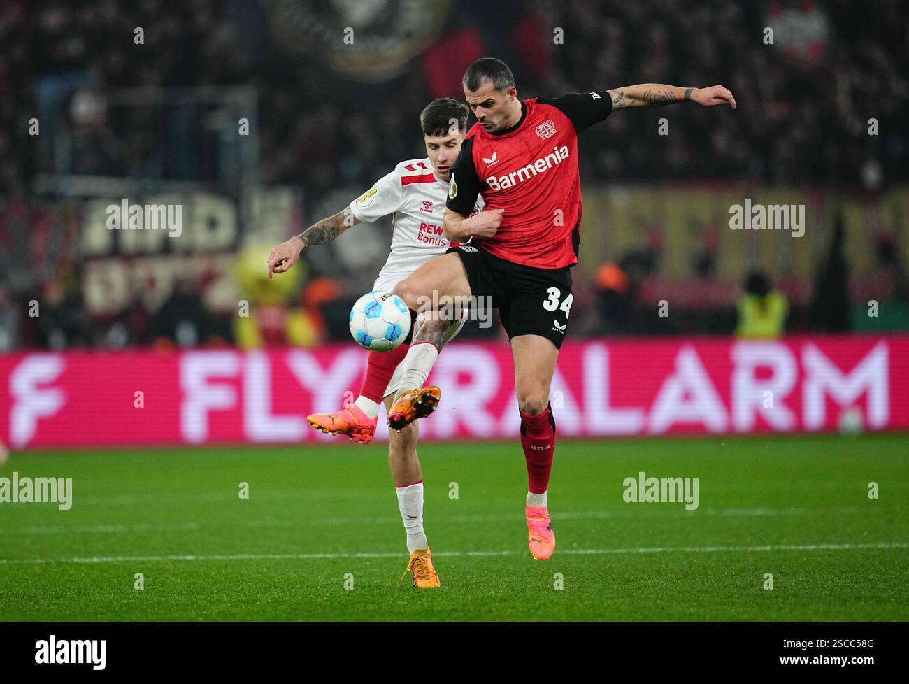 Bay Arena, Leverkusen, Germany. 05th Feb, 2025. Granit Xhaka of Bayer 04 Leverkusen and Denis ...