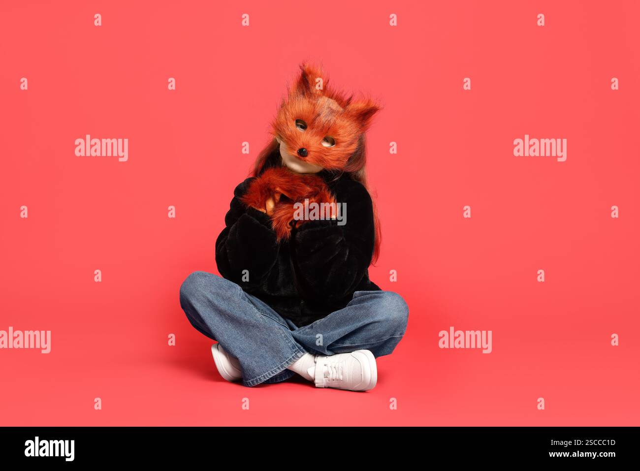 Quadrobics. Girl wearing fox mask and gloves on red background Stock ...