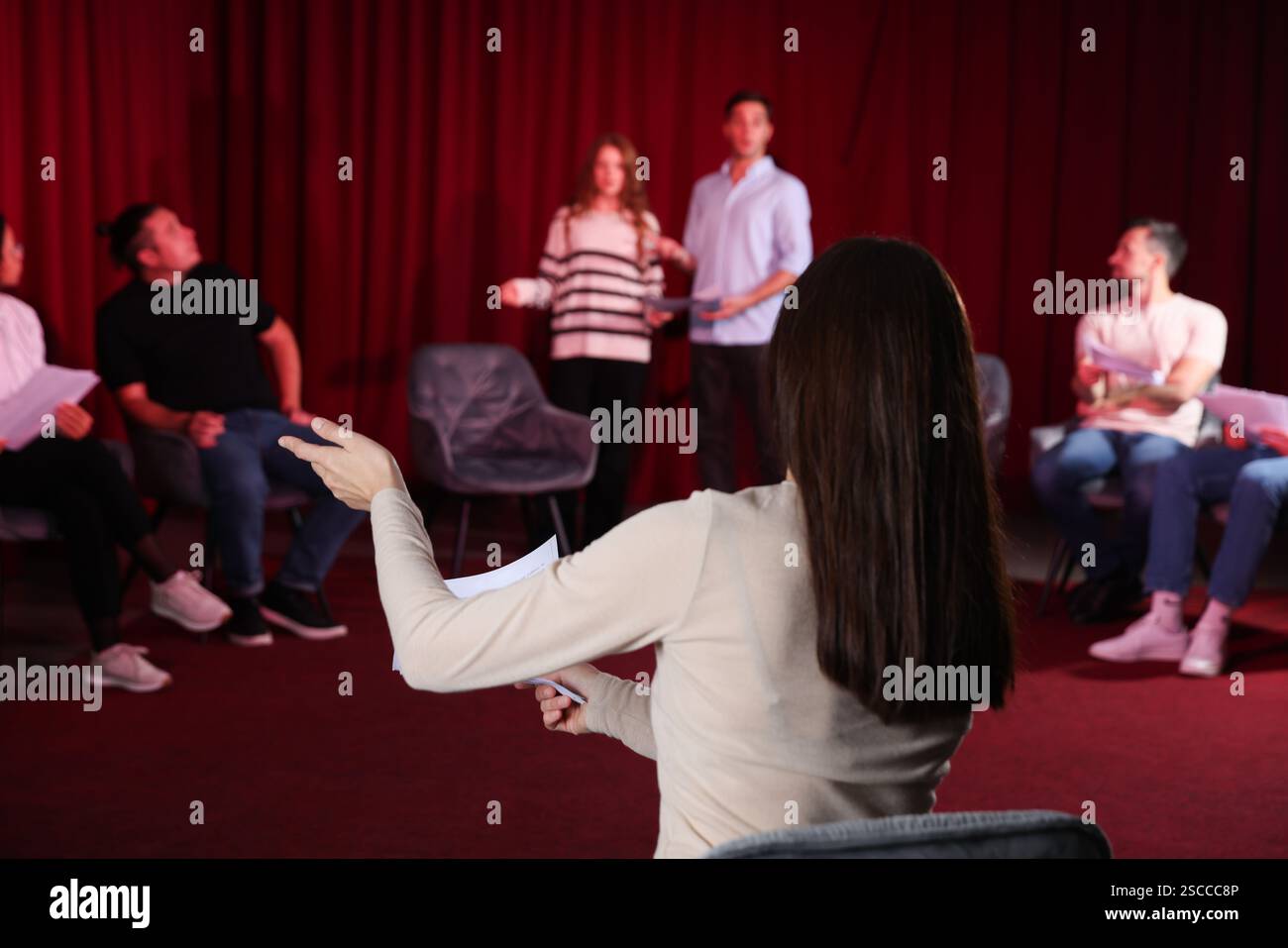 Professional actors with their scripts rehearsing in theatre Stock ...