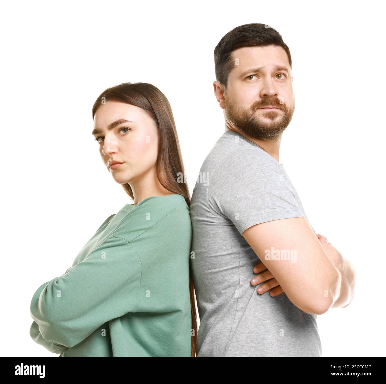 Resentful couple with crossed arms on white background Stock Photo - Alamy