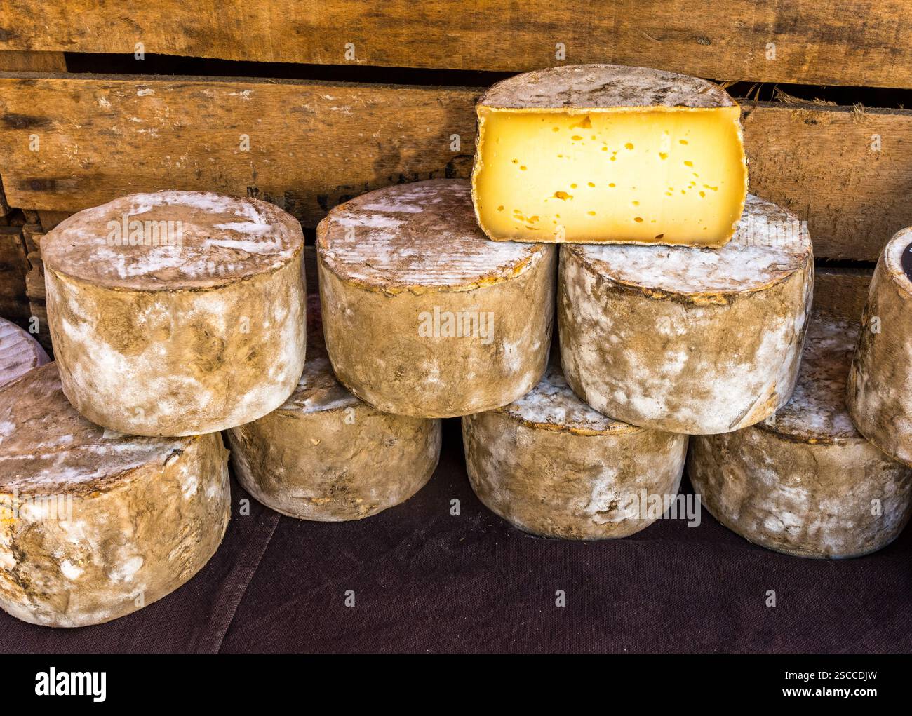 Stacked cheese loaves at the market of St Remy de Provence, Buches du ...