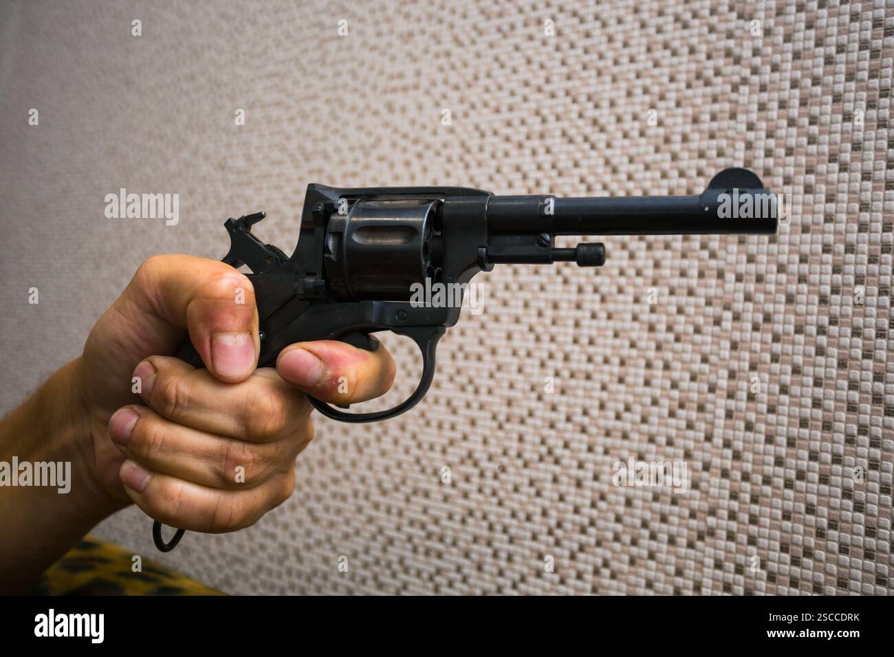 Russian revolver "Nagant M1895" (example of 1913) in hand. Period of ...