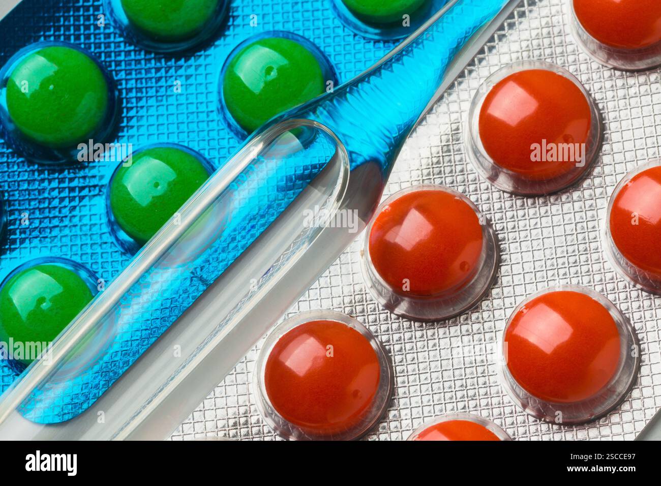 Medical ampule with medicines and drugs on the background of tablets ...