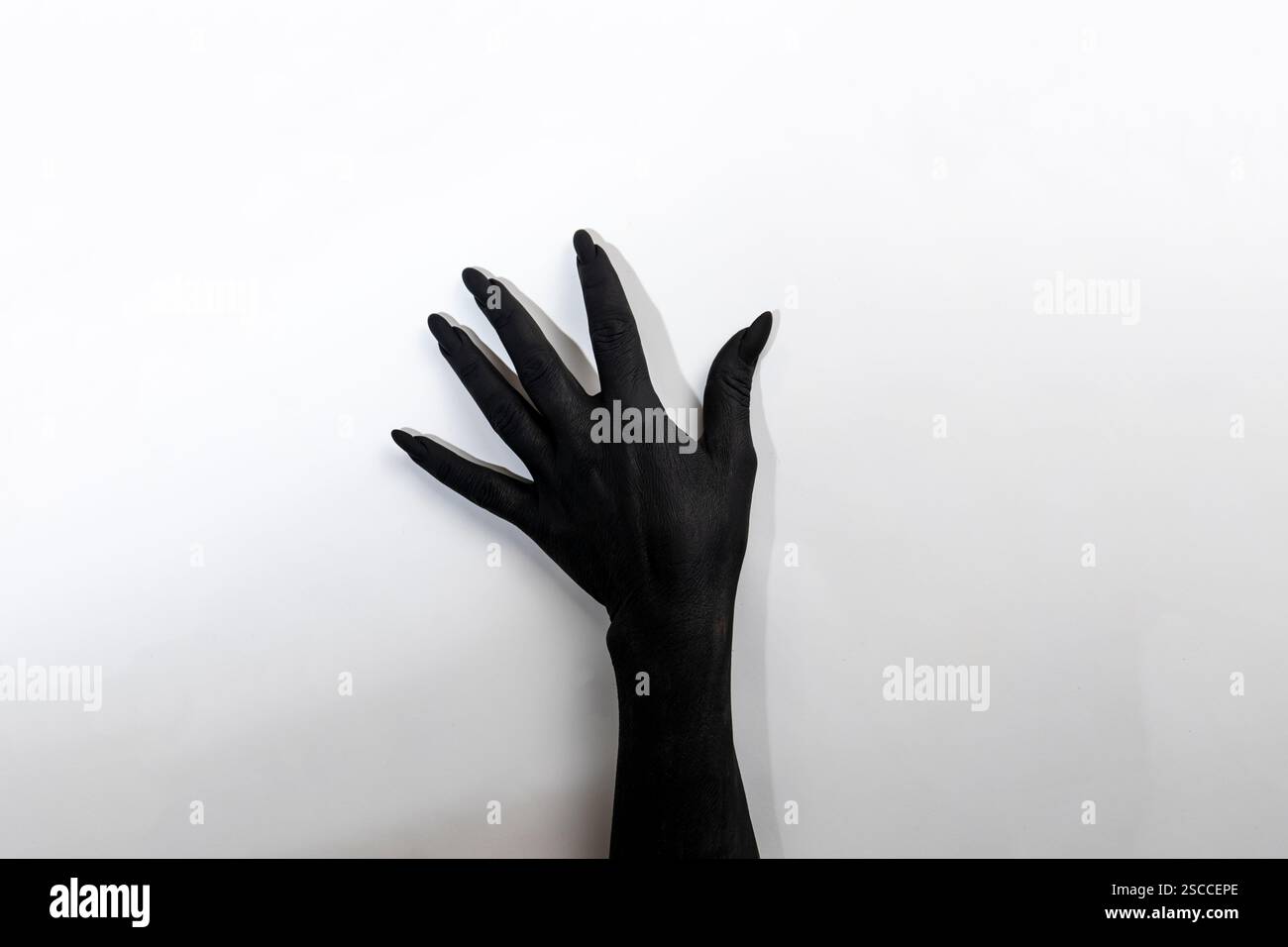 The black hand with long nails. Concept photo with woman hand painted ...