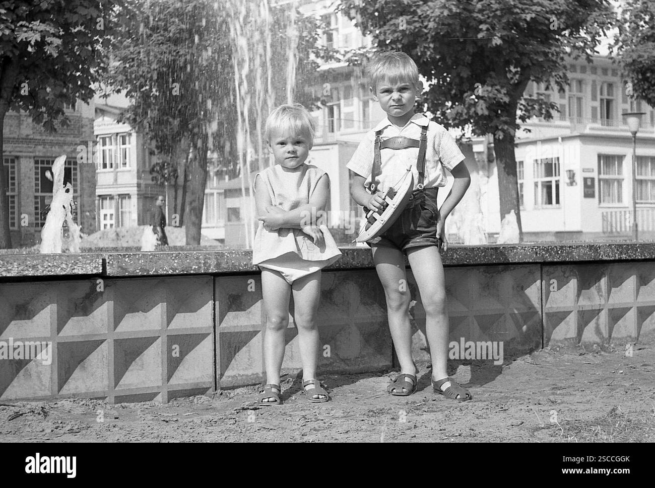 Two small children look critically into the camera in Ahlbeck on the ...