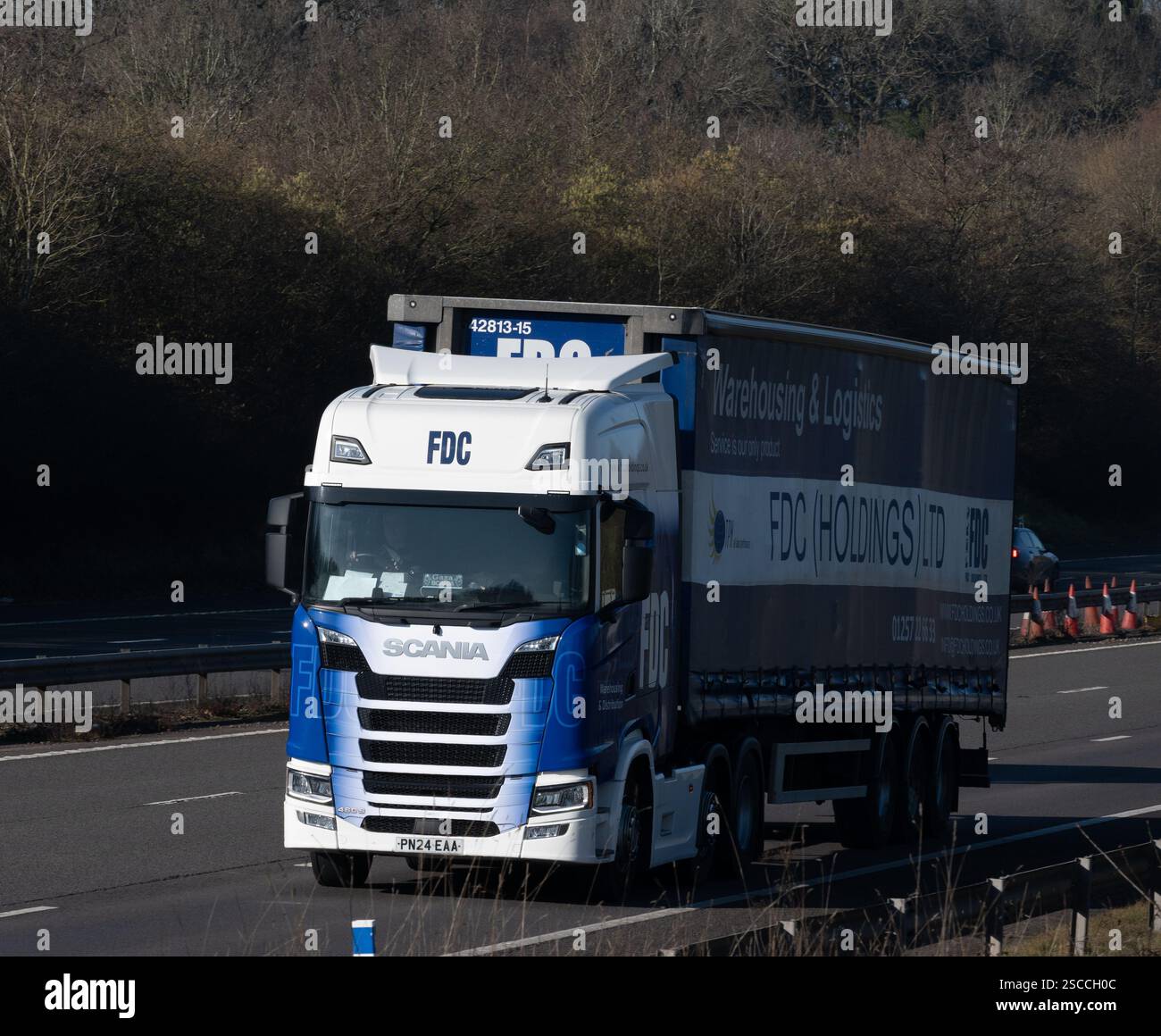 FDC Holdings Scania lorry on the M40 motorway, Warwickshire, UK Stock ...