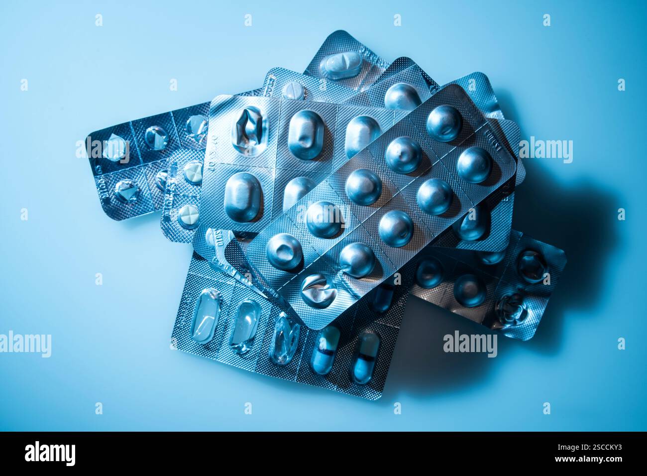 Stack of tablet blisters with partially removed tablets Stock Photo - Alamy