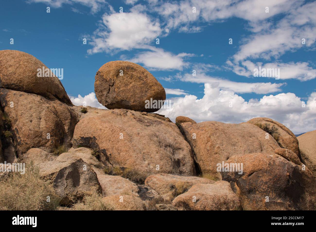 A large round boulder sits on top of rock formations in the Alabama ...