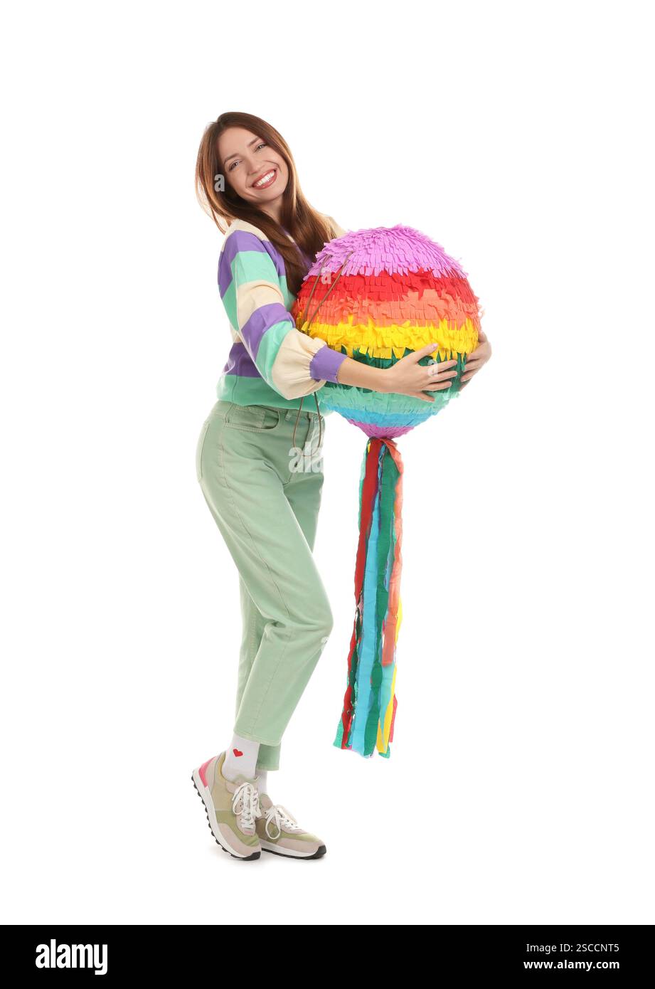 Happy woman with colorful pinata isolated on white Stock Photo - Alamy