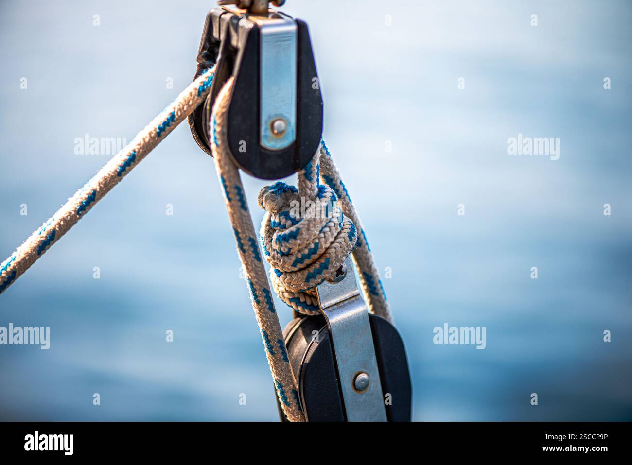 A detailed macro view of a ship’s rope and winch, capturing the ...