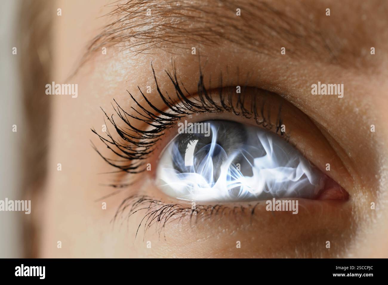 Hypnosis. Hypnotic smoke in woman's eye, closeup Stock Photo - Alamy