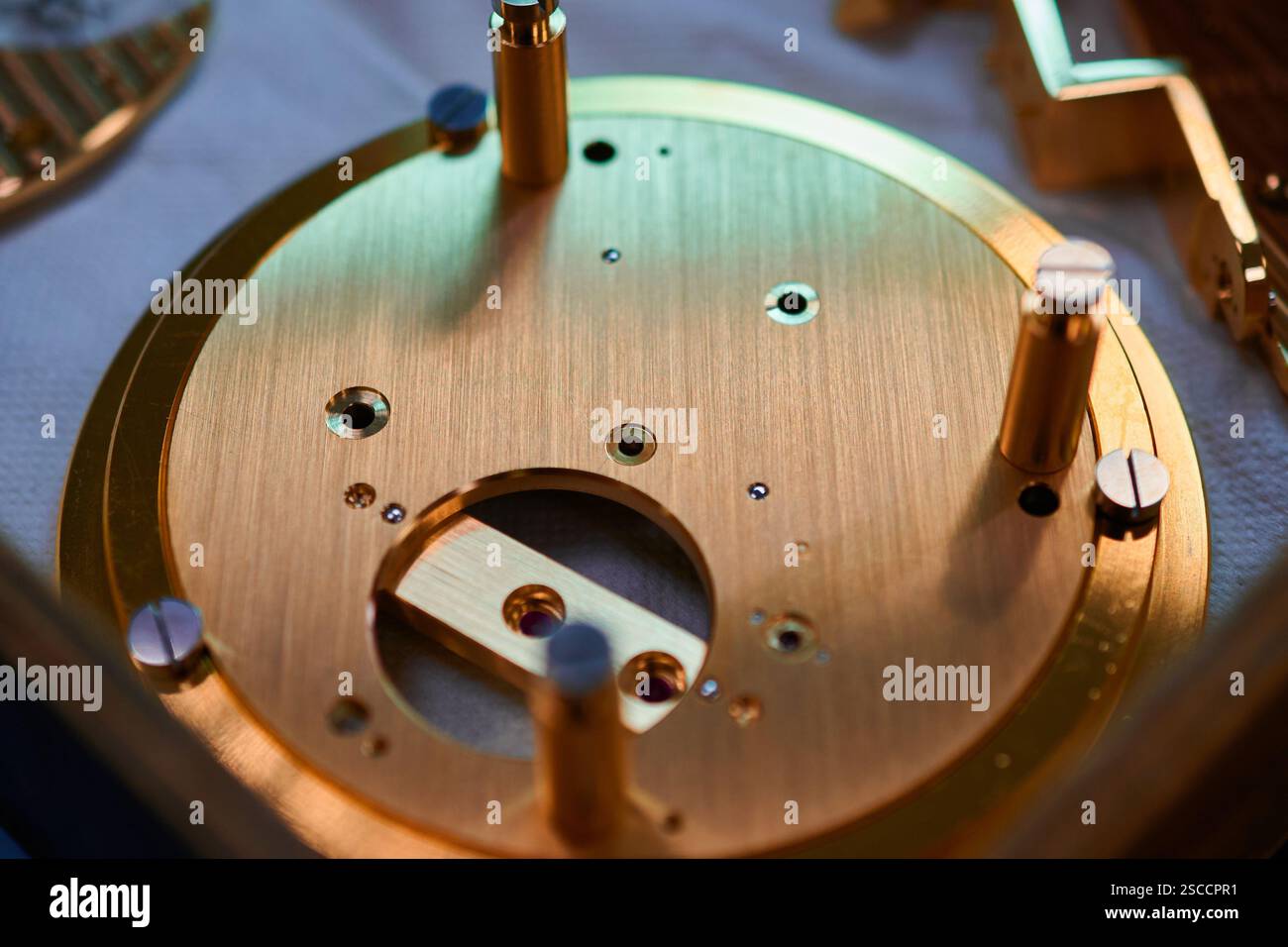 Intricate details of a watch mechanism base reveal the artistry of ...