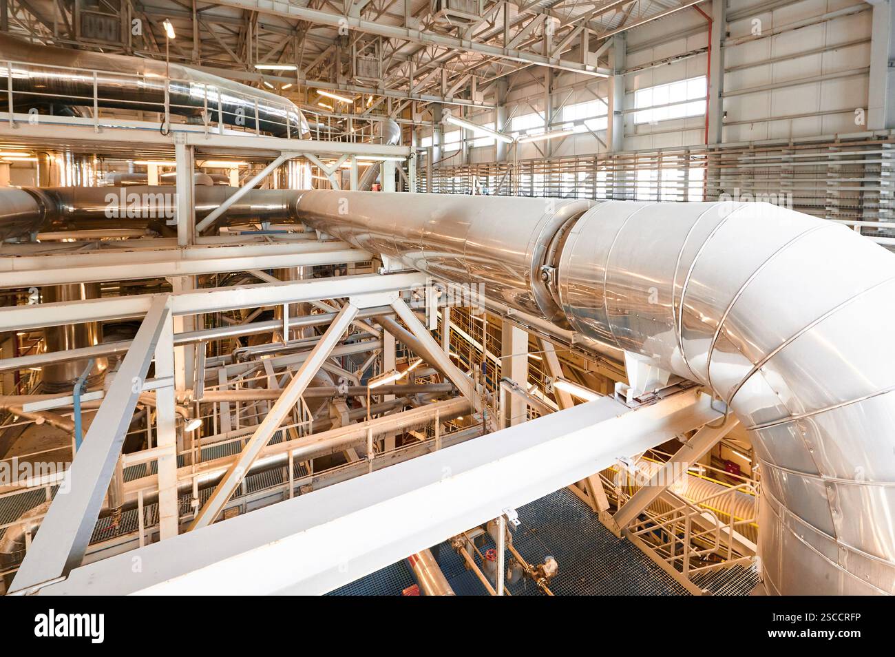 Pipelines and conveyor systems inside a chemical plant showcasing ...