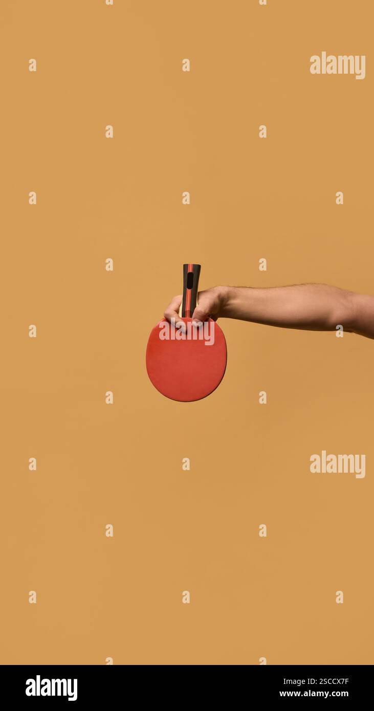 Hand extending red table tennis paddle horizontally, illustrating ...