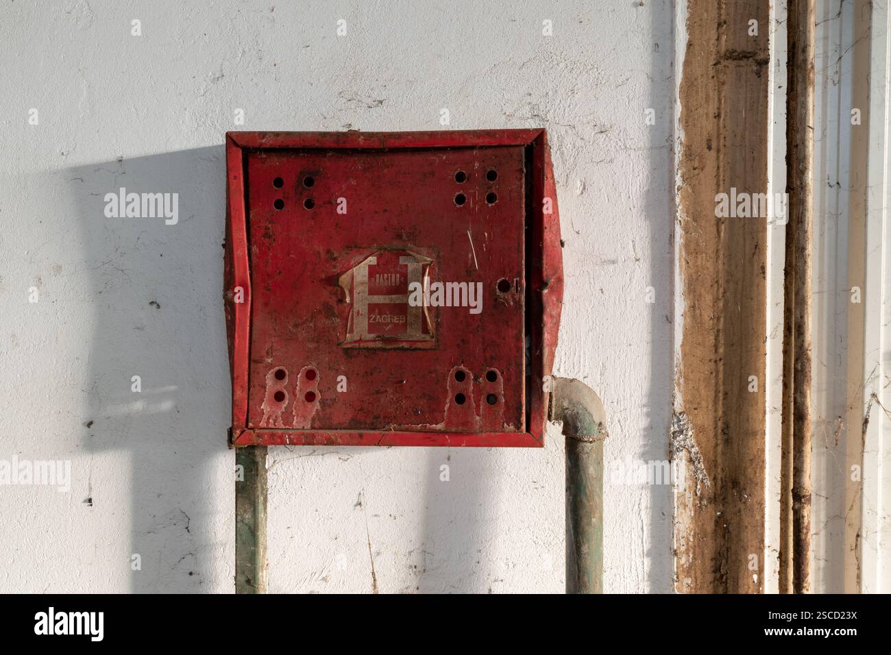 Old broken hydrant box on wall, abandoned building Stock Photo - Alamy