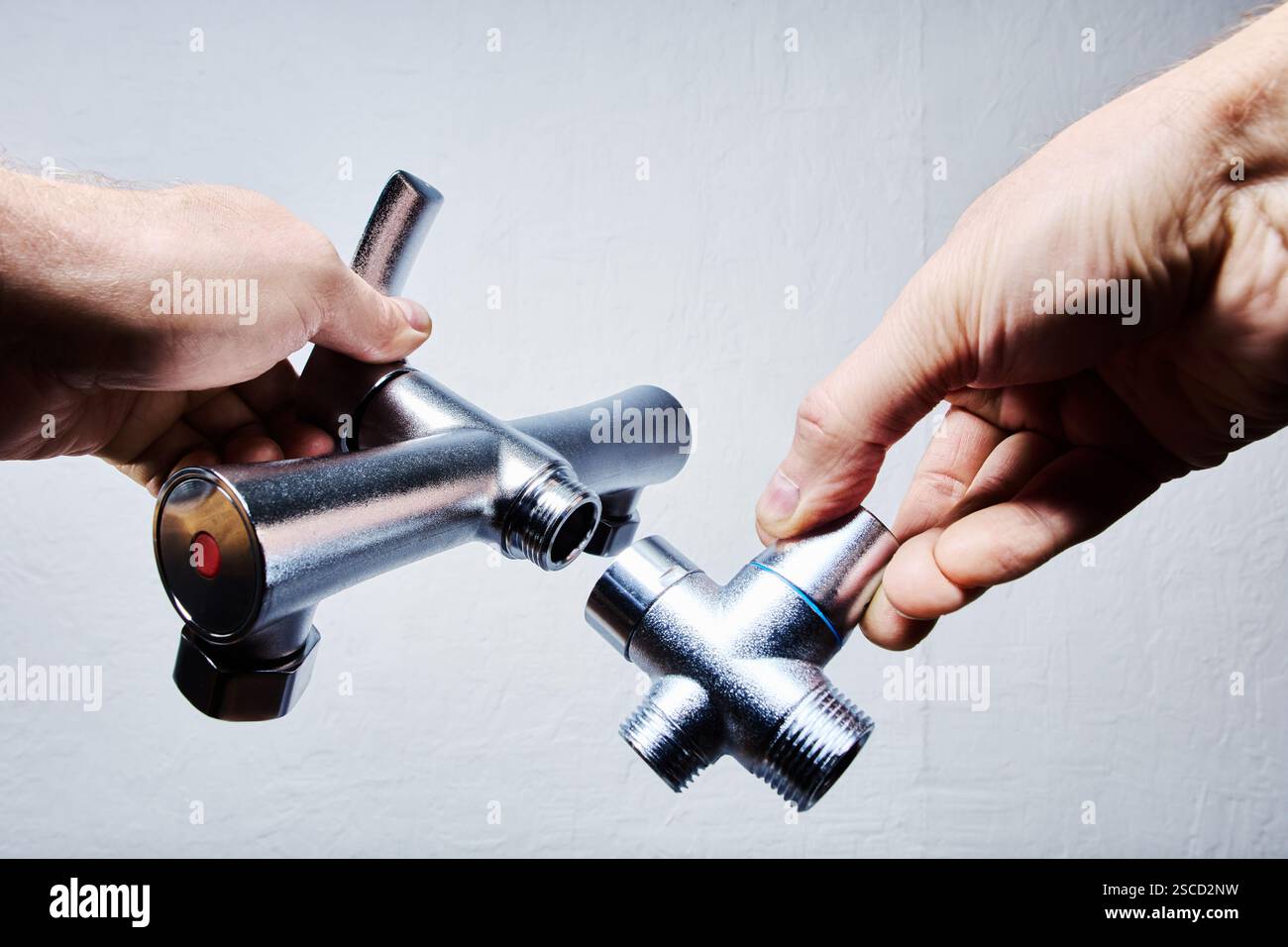 Control handles and shower faucet combo being assembled, highlighting ...