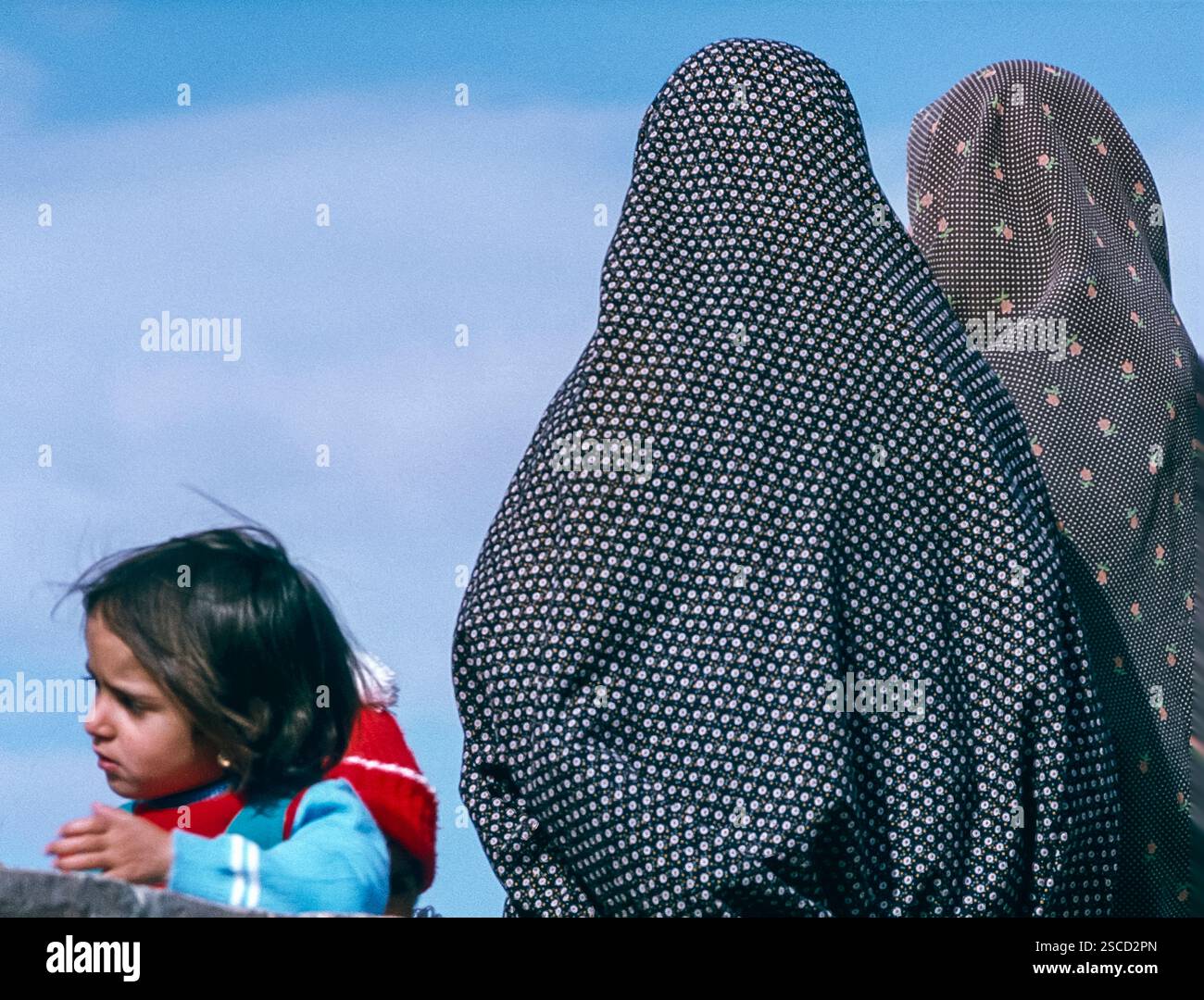 The image is of an impromptu street market in the town of Shahreza not ...