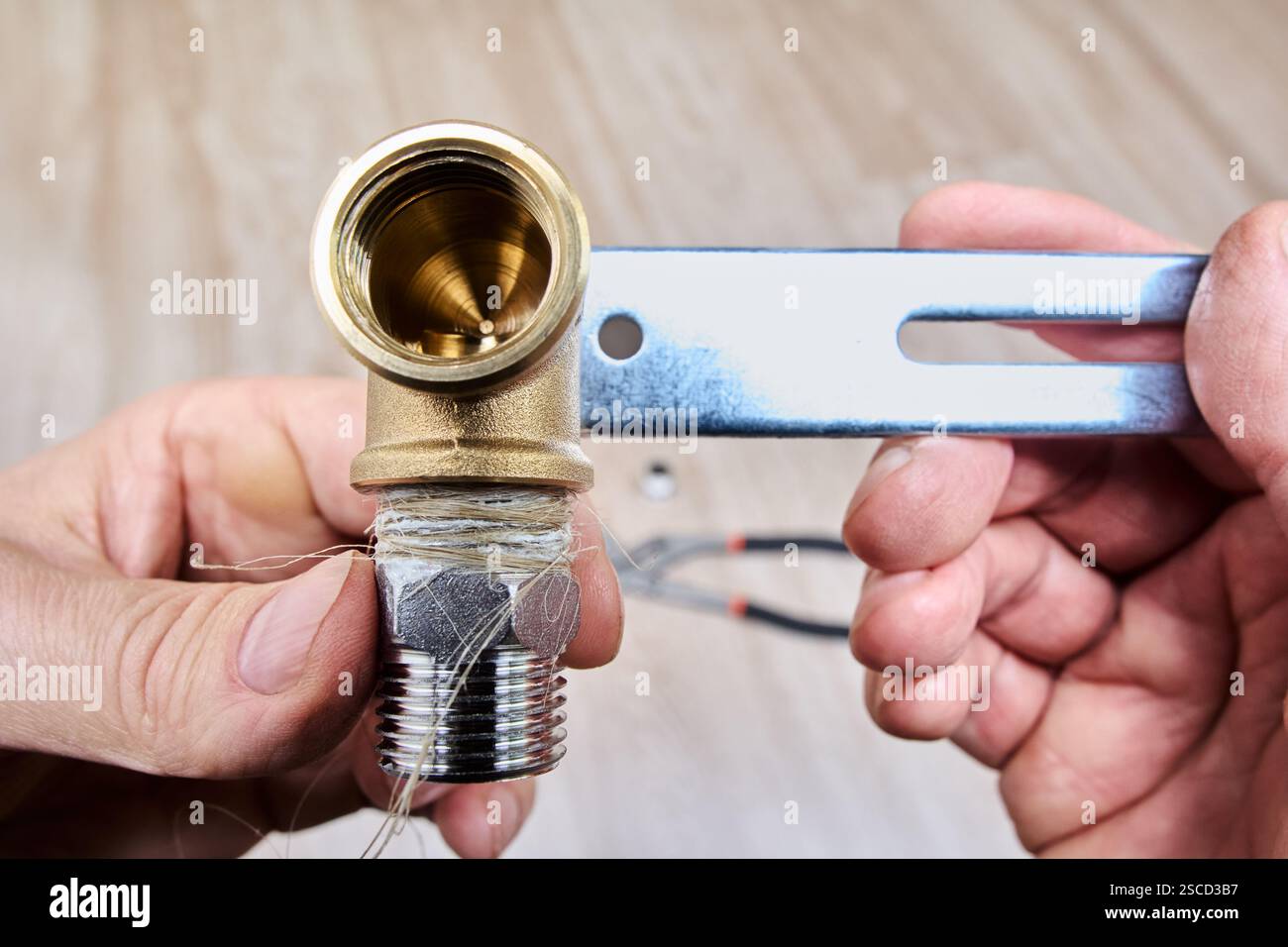 Applying plumbing flax ensures leak proof connection while installing ...