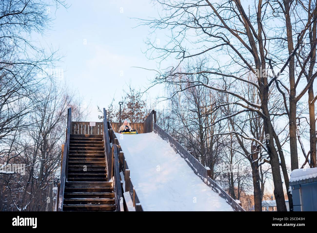 Winter recreation and fun, snow, roller coasters, flat sledding Stock ...