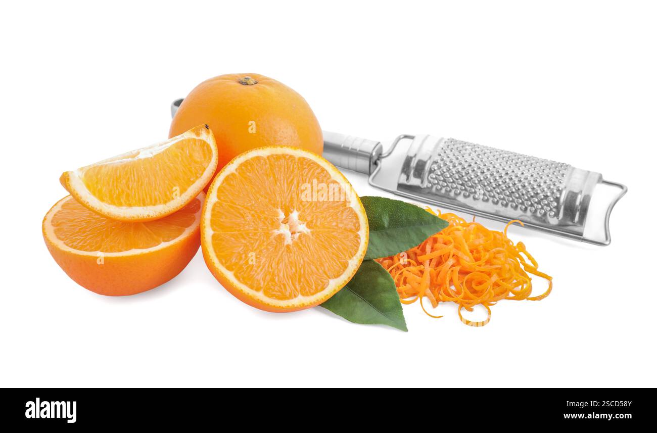 Pile of fresh orange zest, fruits, leaves and grater isolated on white ...