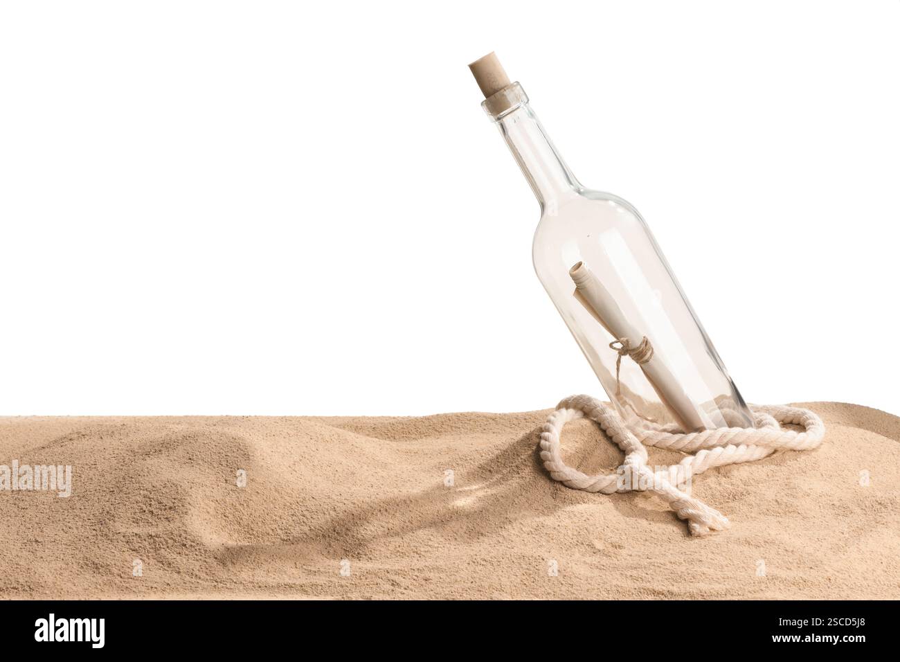 Rolled letter in corked glass bottle and rope on sand against white ...