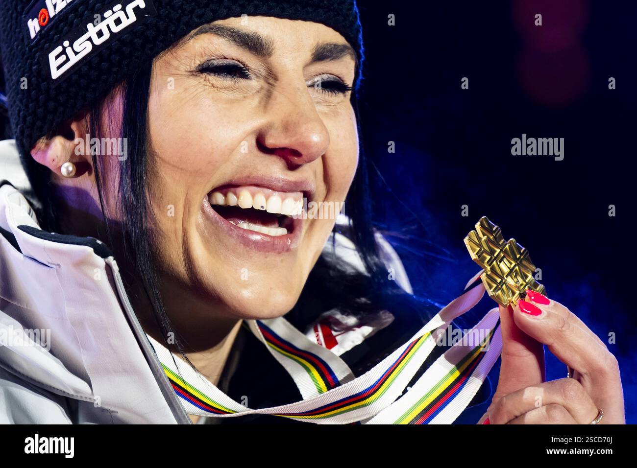 Austria's Stephanie Venier shows the gold medal for a women's Super-G ...