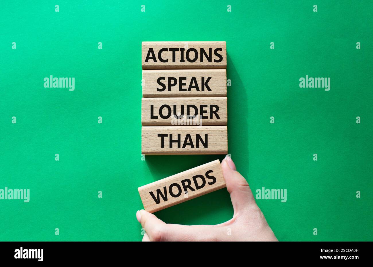 Actions speak louder than Words symbol. Wooden blocks with words ...