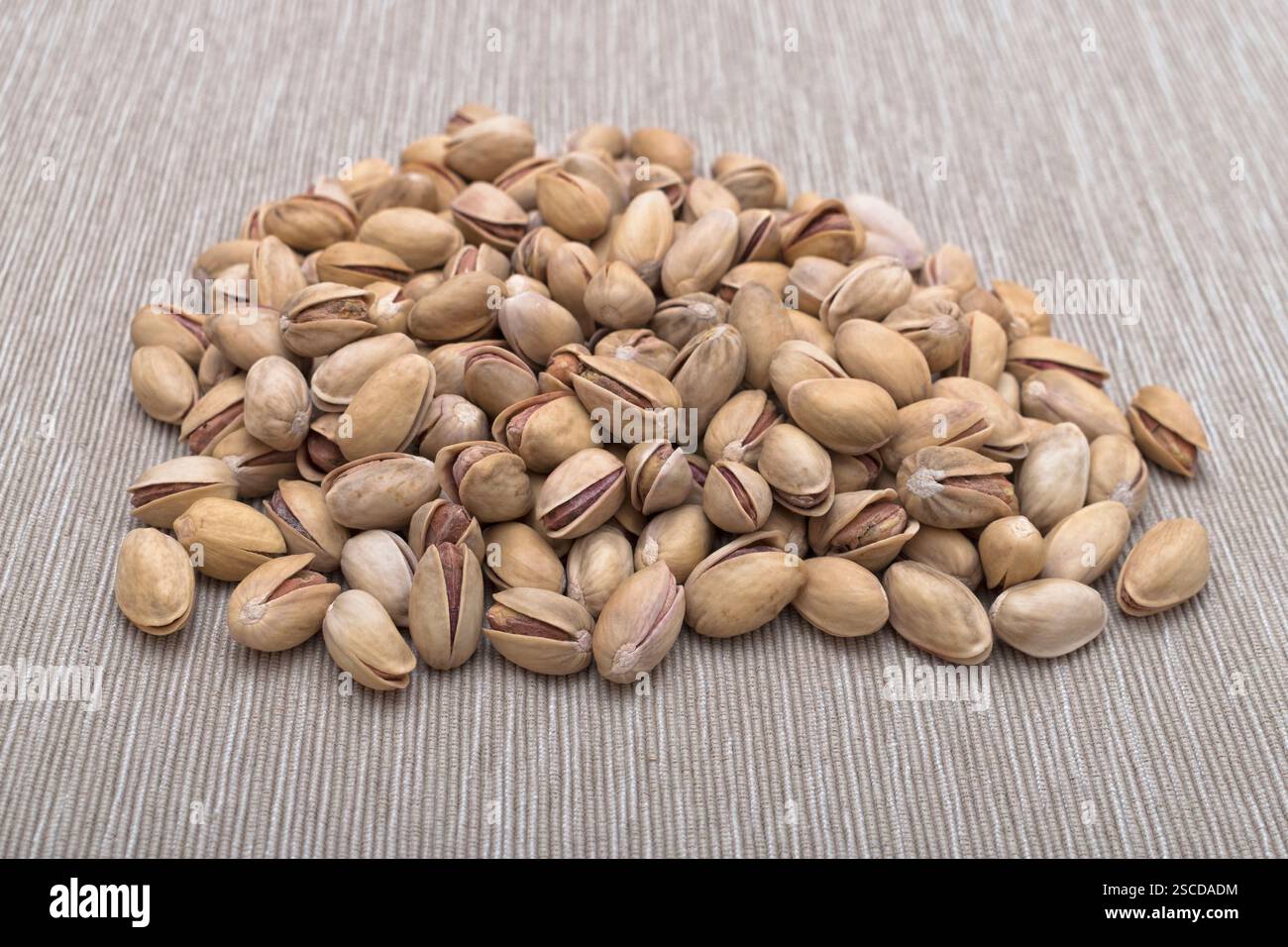 Roasted pistachio nuts in shells. Natural food peanuts stacked background Stock Photo - Alamy
