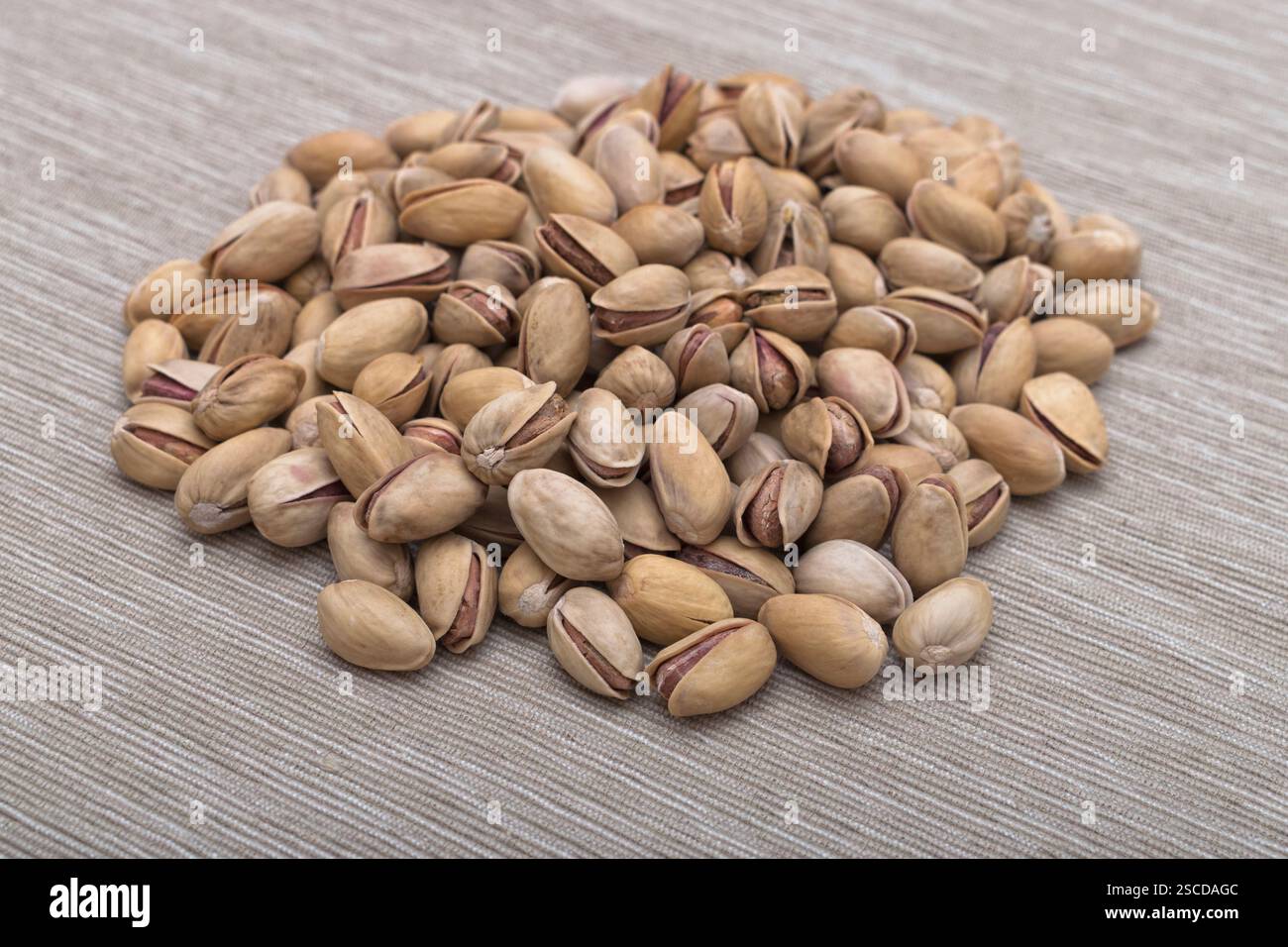 Roasted pistachio nuts in shells. Natural food peanuts stacked background Stock Photo - Alamy