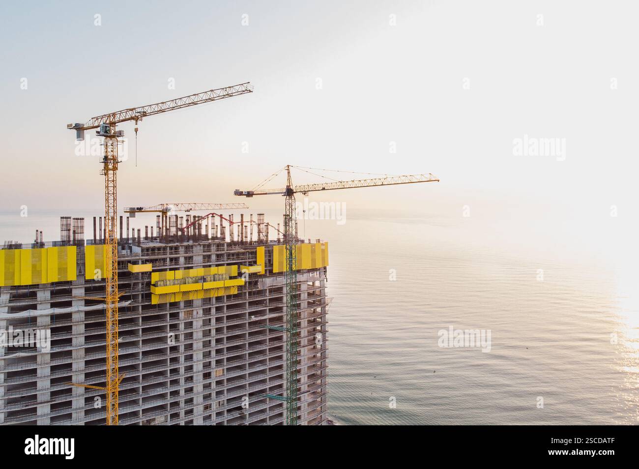 Construction tower cranes on construction site. Construction cranes ...