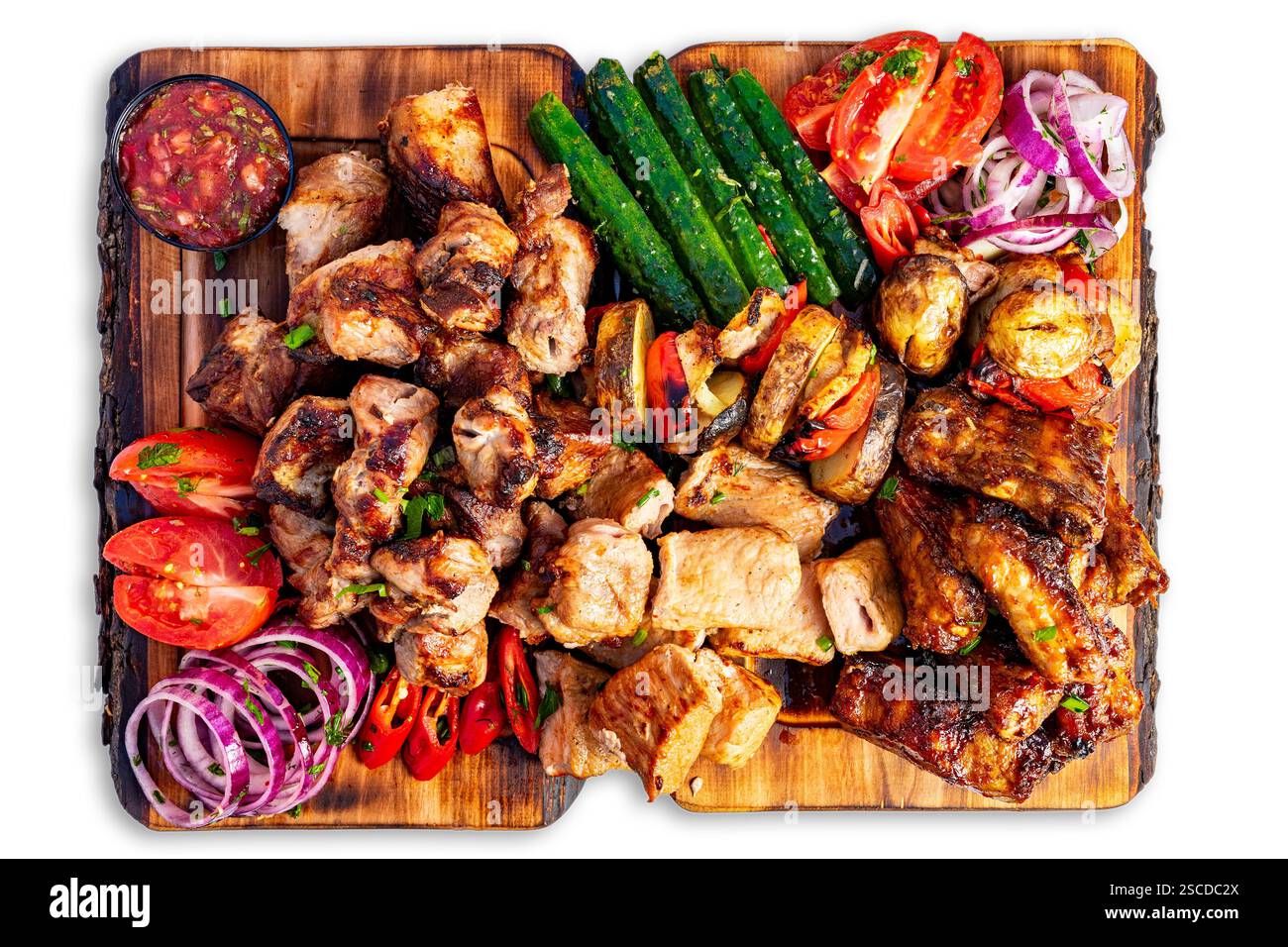 A vibrant platter features a variety of grilled meats alongside fresh ...