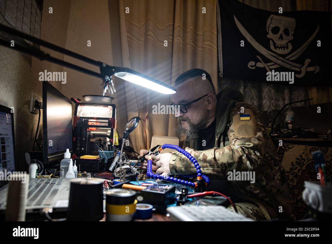 A Ukrainian soldier repairs a FPV drone in a drone repair workshop ...