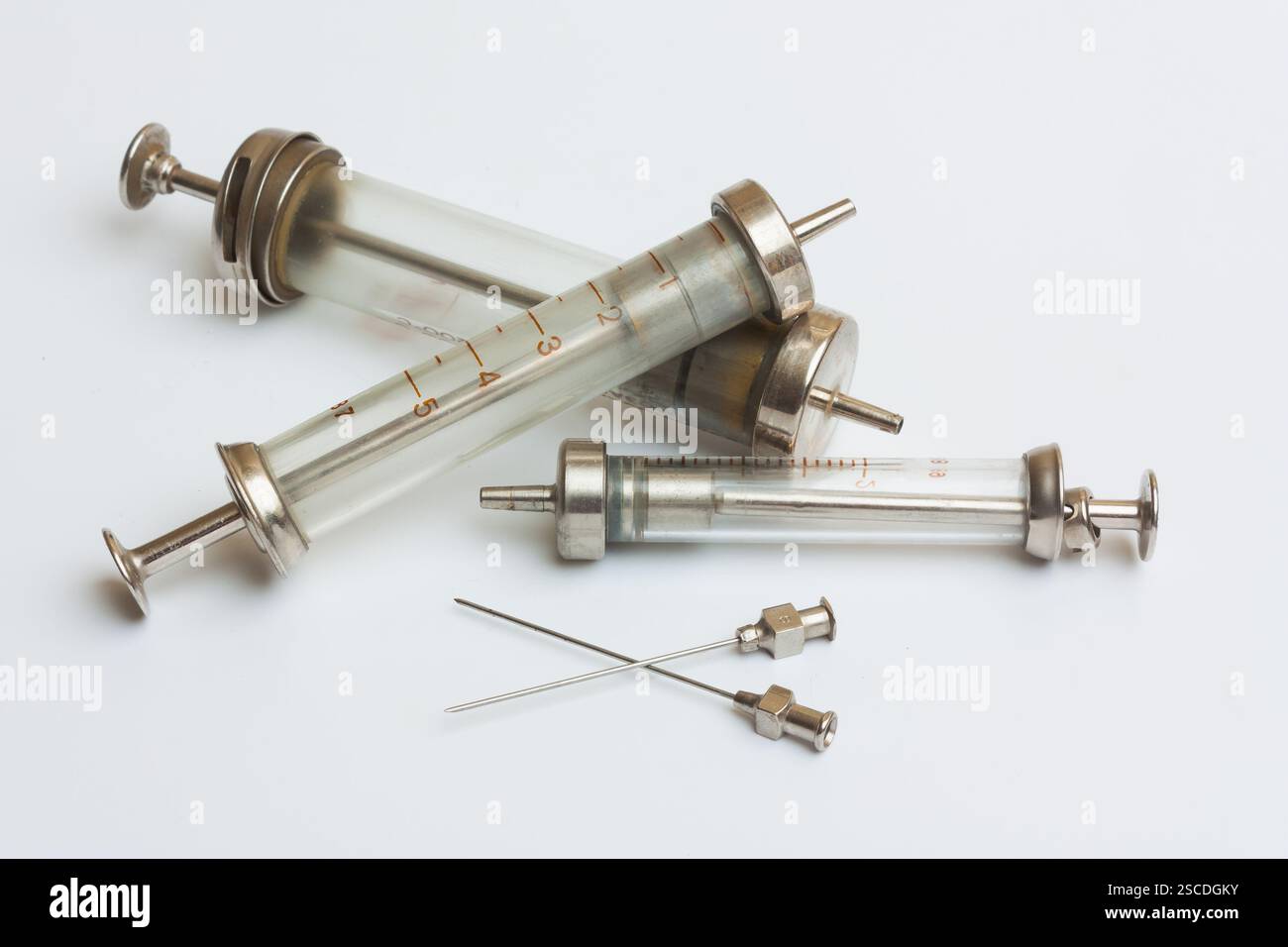 syringes old model on a white background Stock Photo - Alamy