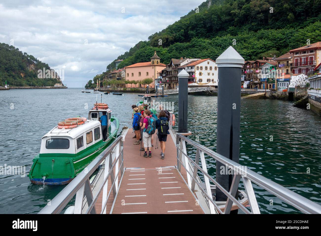 Heritage buildings and boats line the vibrant harbour of Pasaia along ...