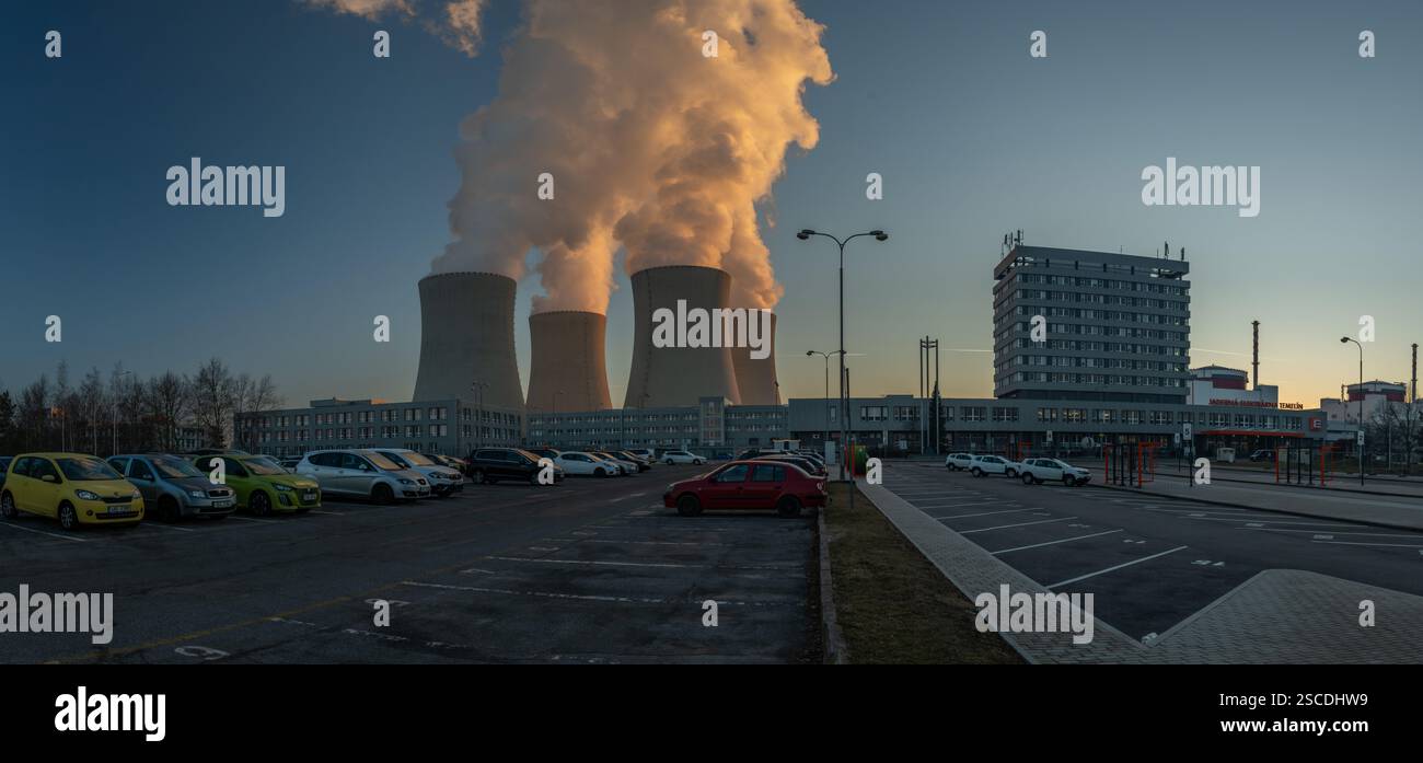 Big chimneys with white smoke in winter sunny day near nuclear power ...