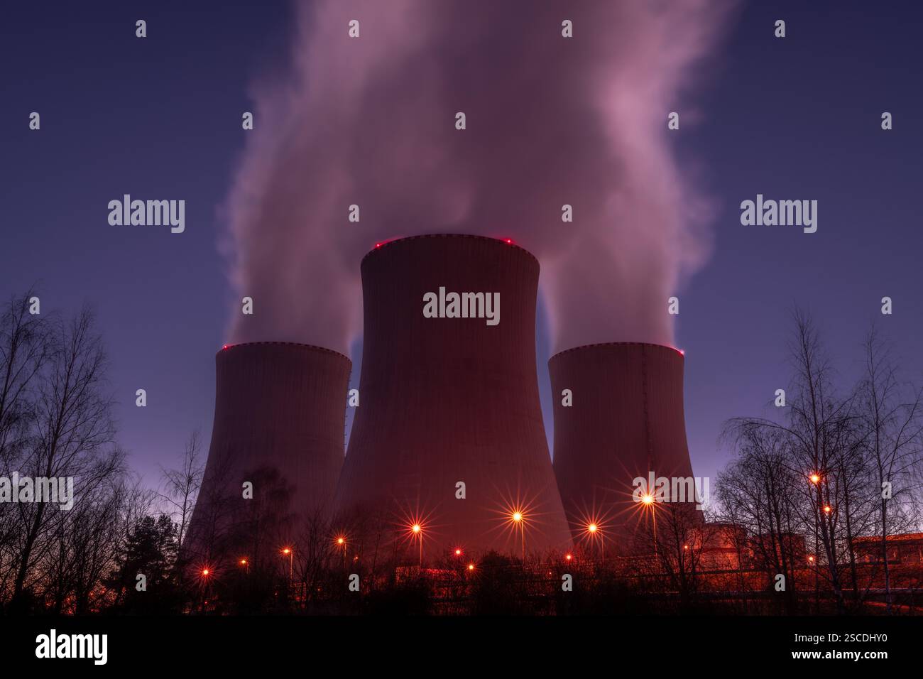 Night with color light in winter cold view for nuclear power plant in ...