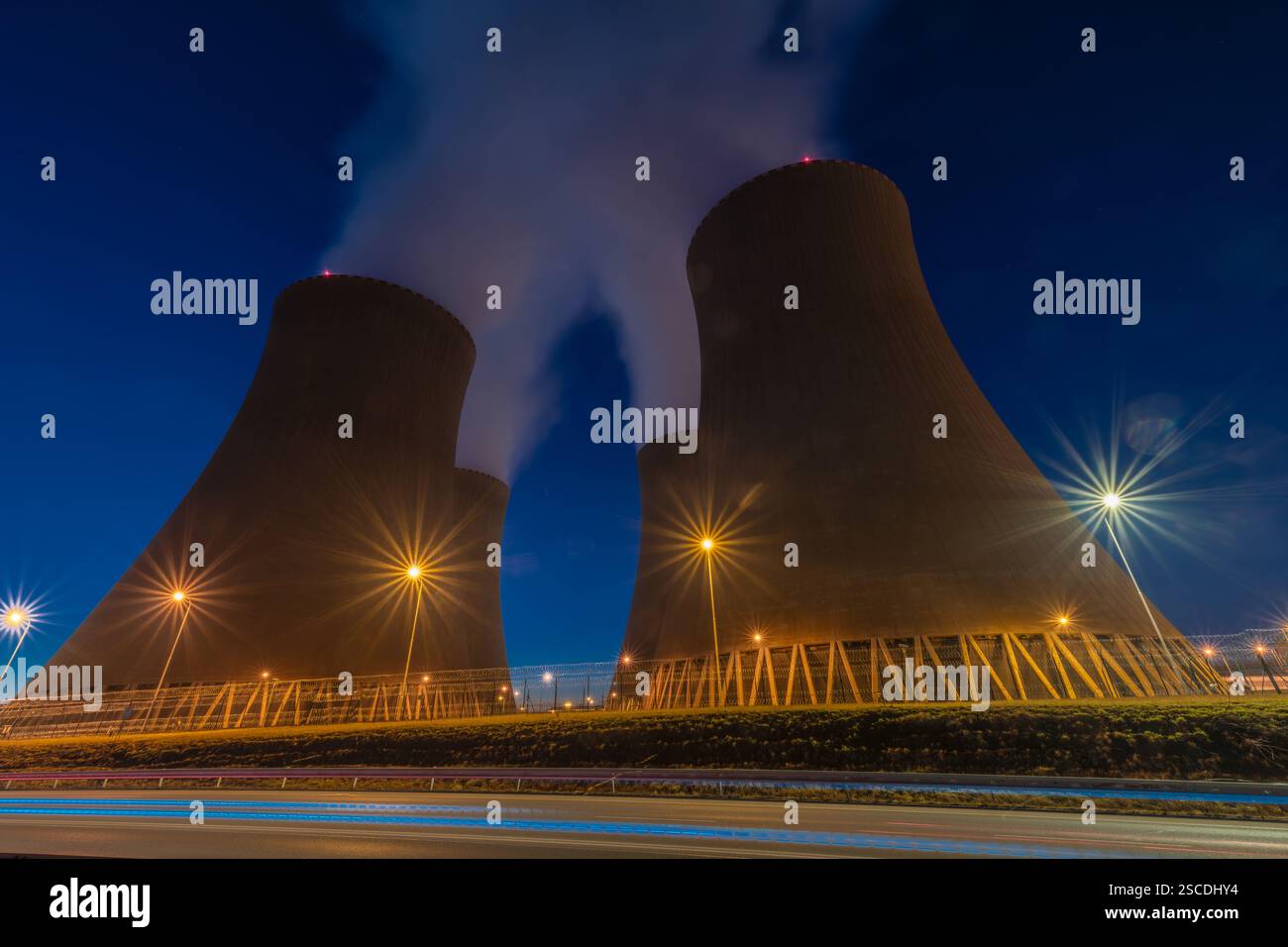 Night with color light in winter cold view for nuclear power plant in ...