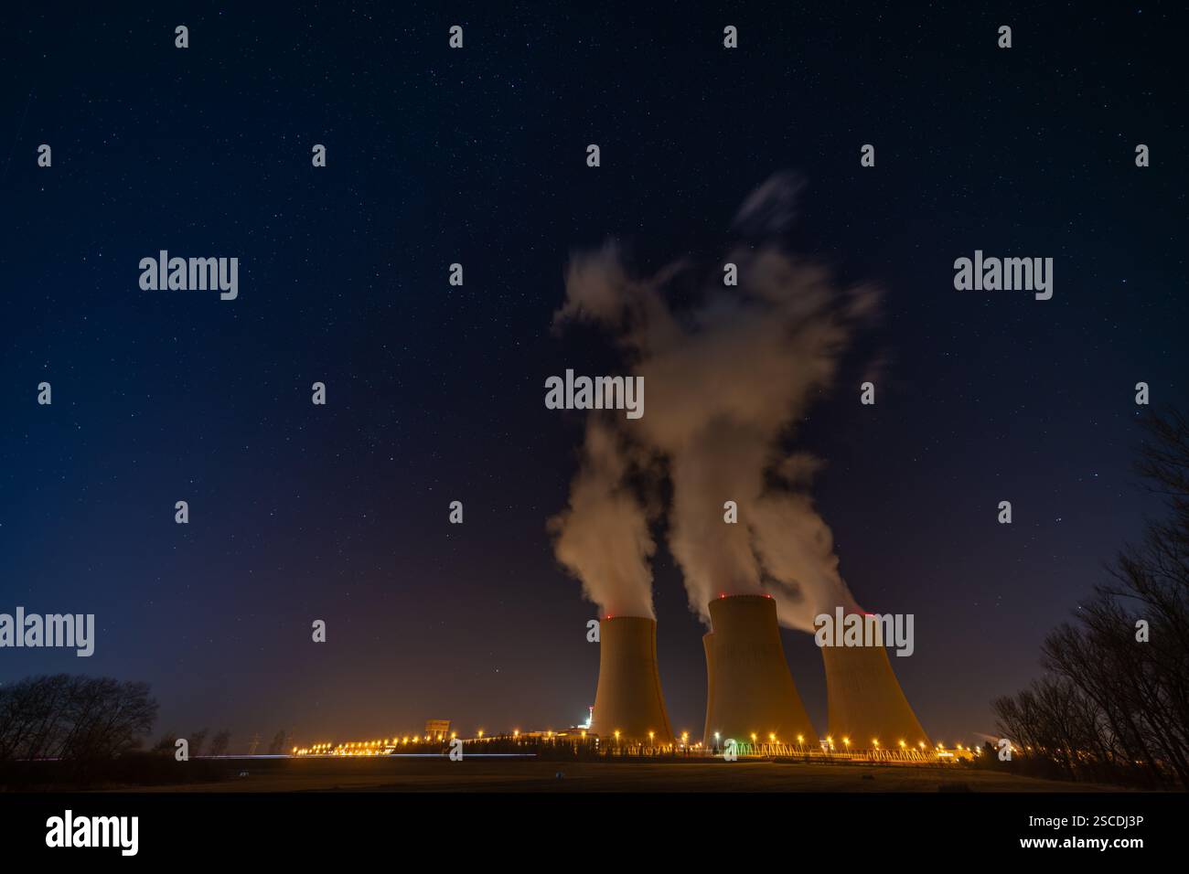 Night with color light in winter cold view for nuclear power plant in ...