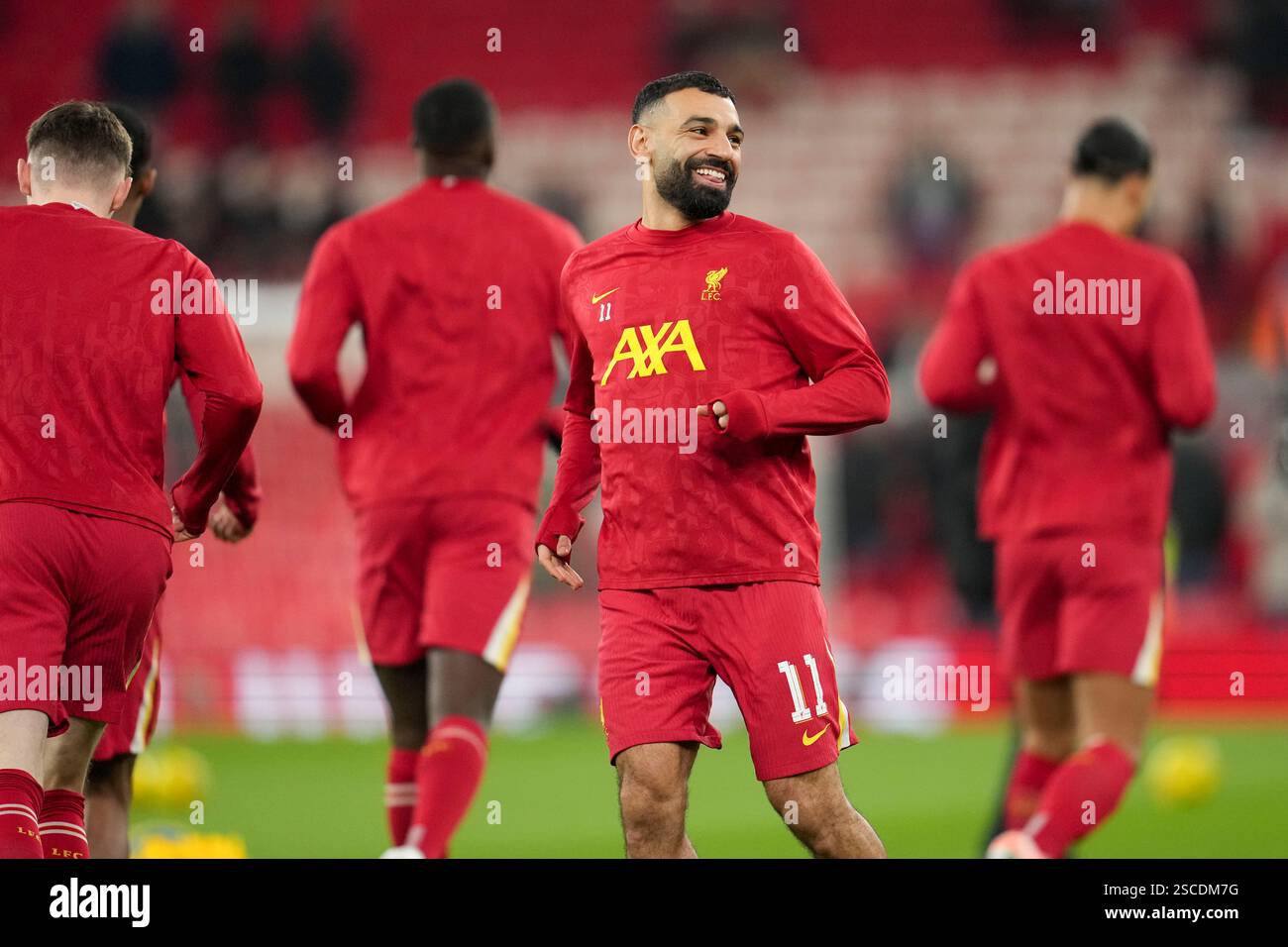 Liverpool's Mohamed Salah smiles as he warms-up before the English ...