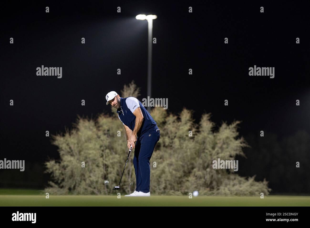 Captain Dustin Johnson of 4Aces GC putts on the seventh green during ...